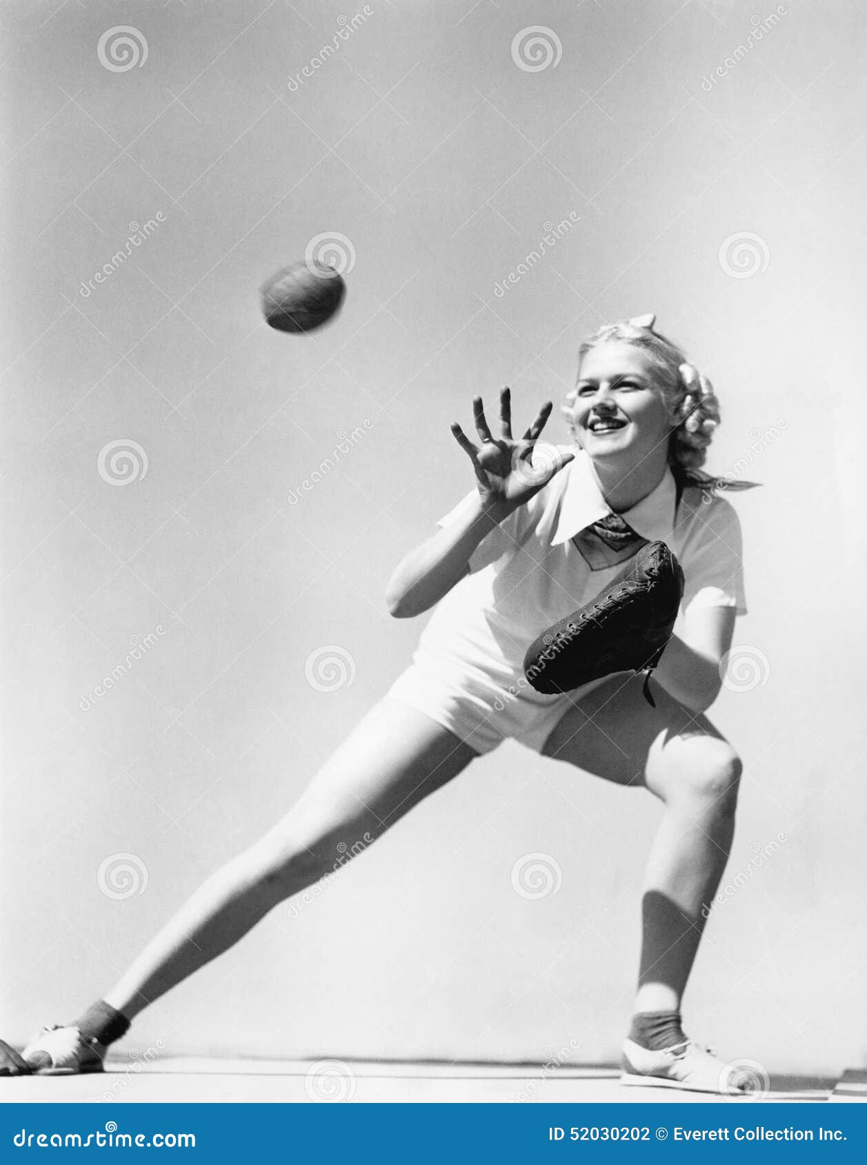 Woman catching a baseball stock photo. Image of away - 52030202