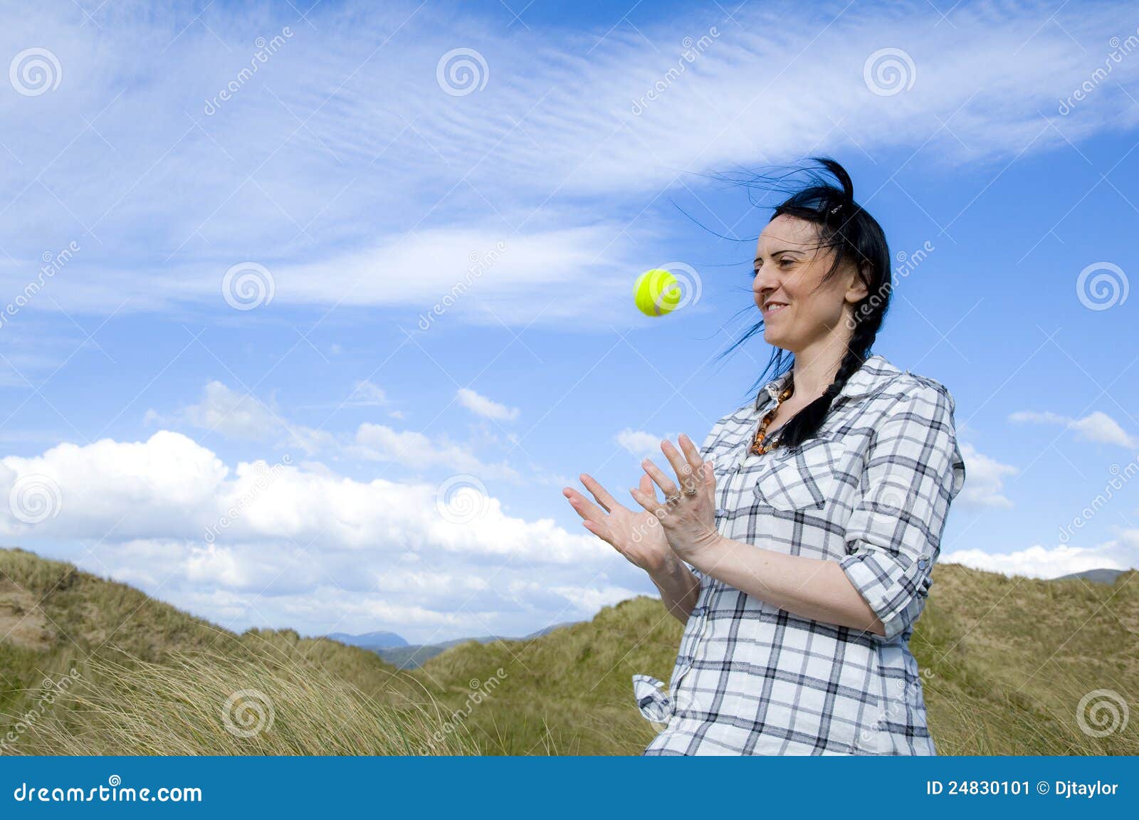 Woman catching tennis ball stock image. Image of grass - 24830101
