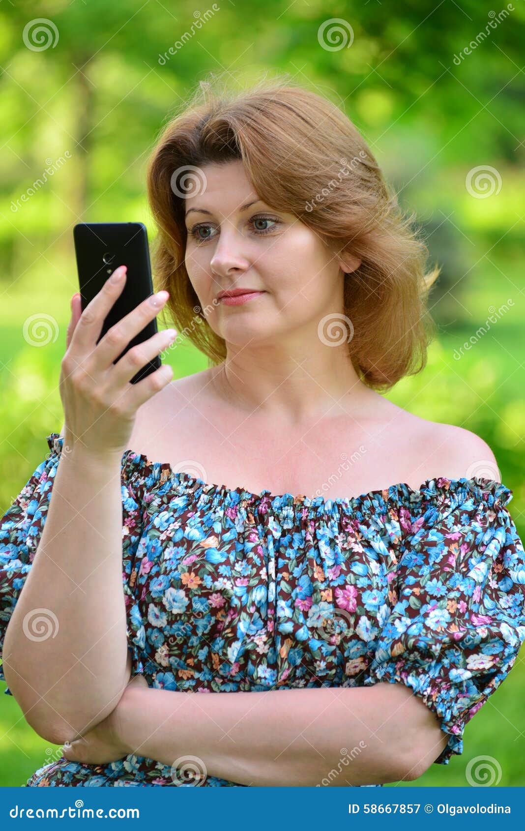 Woman with a Cell Phone in Nature at the Summer Stock Image - Image of ...