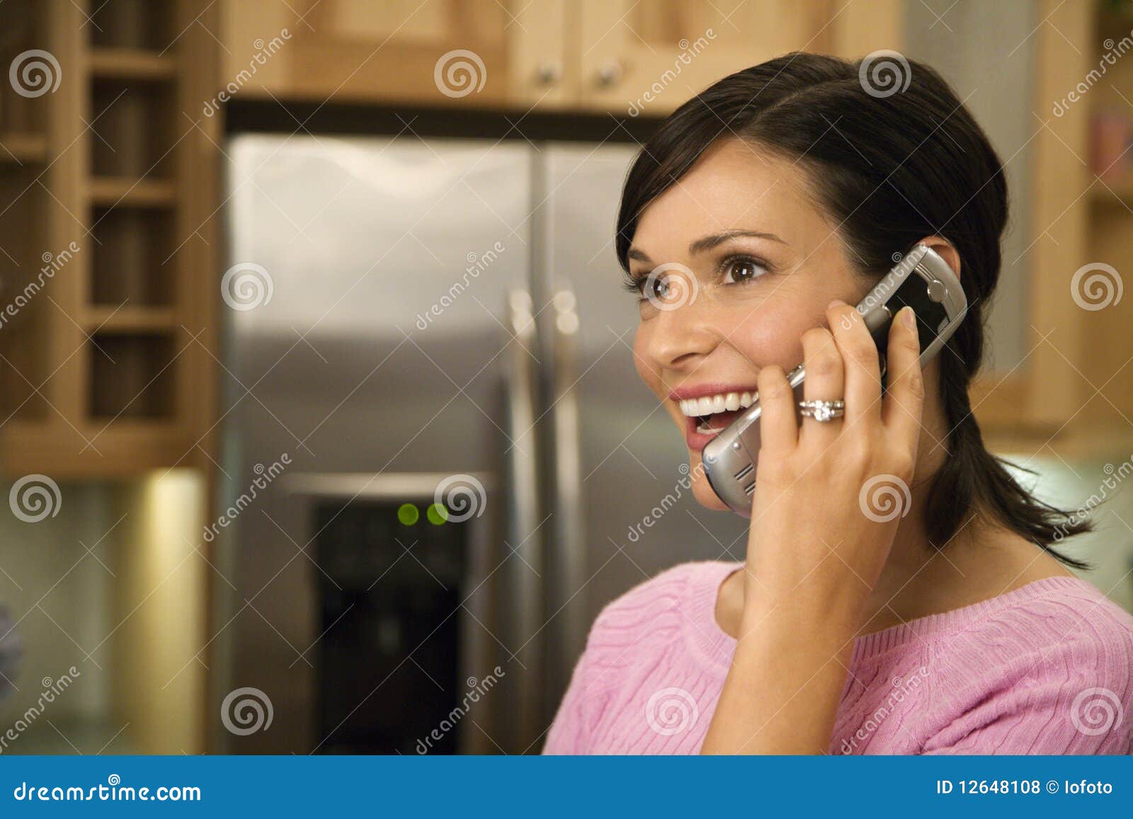 Woman on Cell Phone Smiling Stock Photo - Image of cellular, cabinets ...