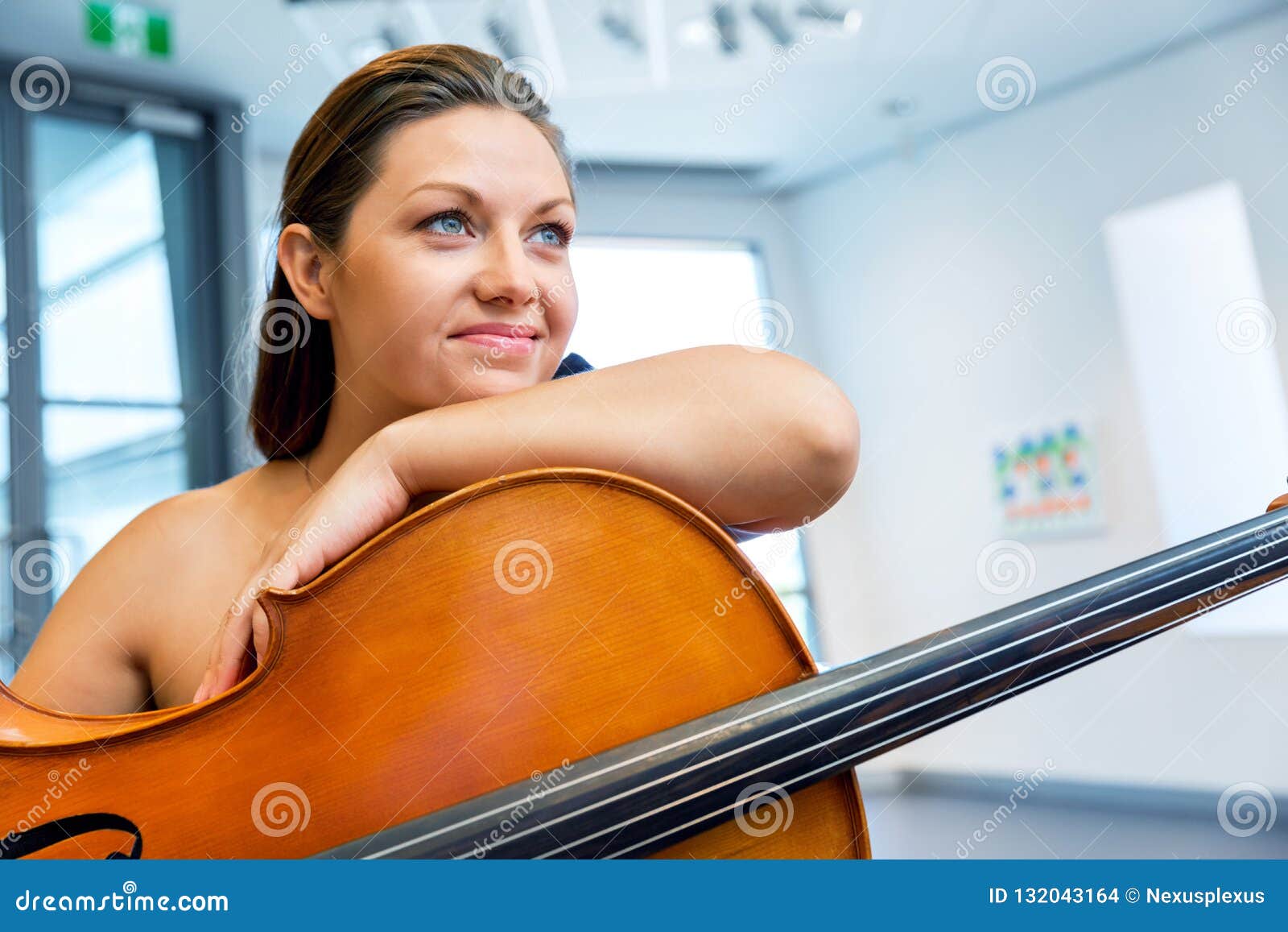 Woman with a cello stock photo. Image of seat, studio - 132043164