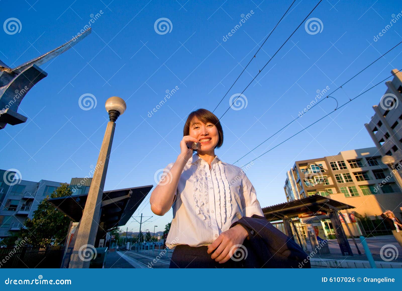 Woman on Cellphone Smiles at Camera Stock Photo - Image of asian ...