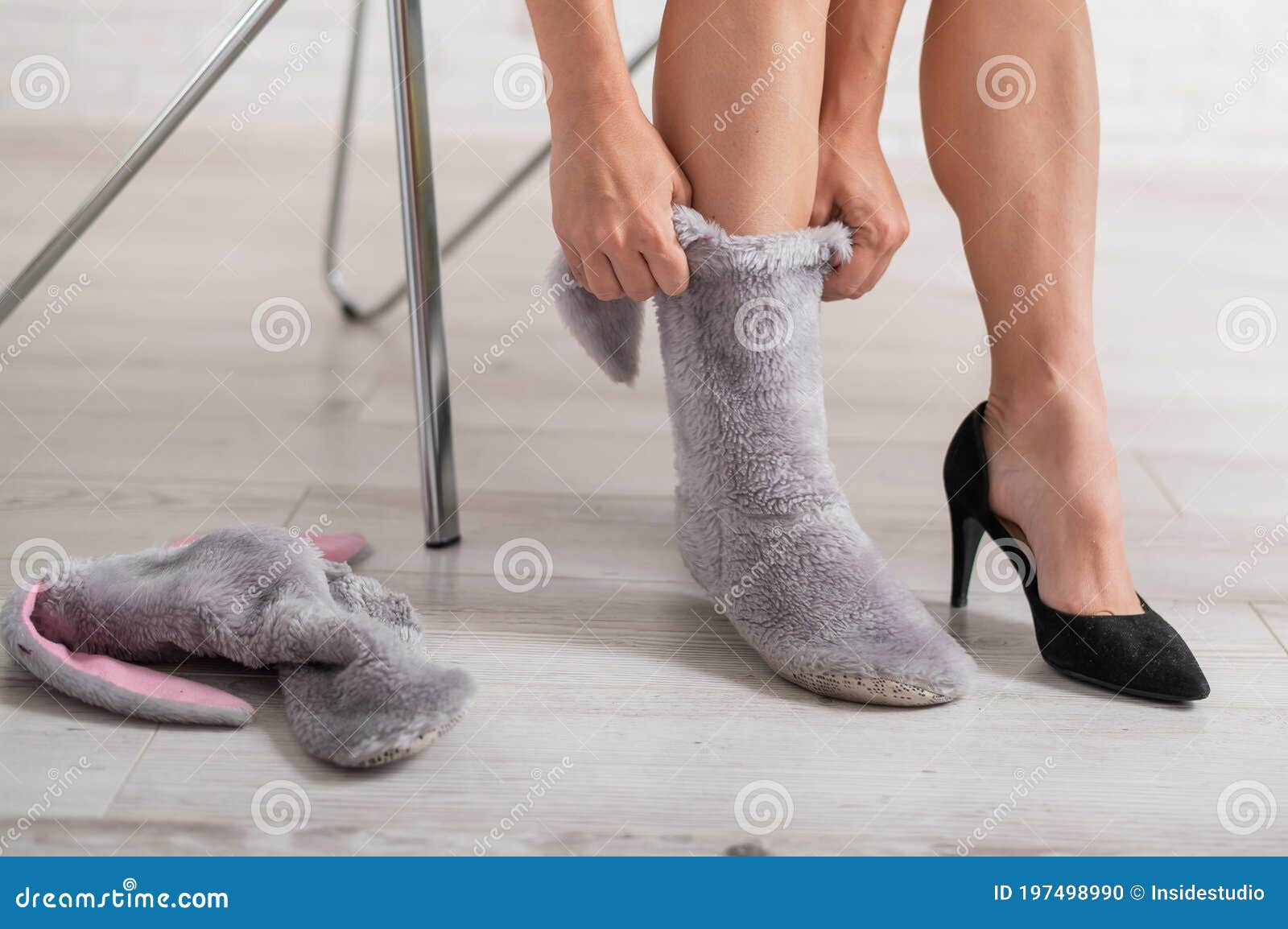 A Woman Changes Black Classic Shoes for Slippers after a Working Day ...