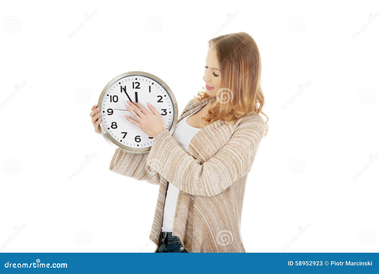 Woman changes clock leads. stock image. Image of hands - 58952923