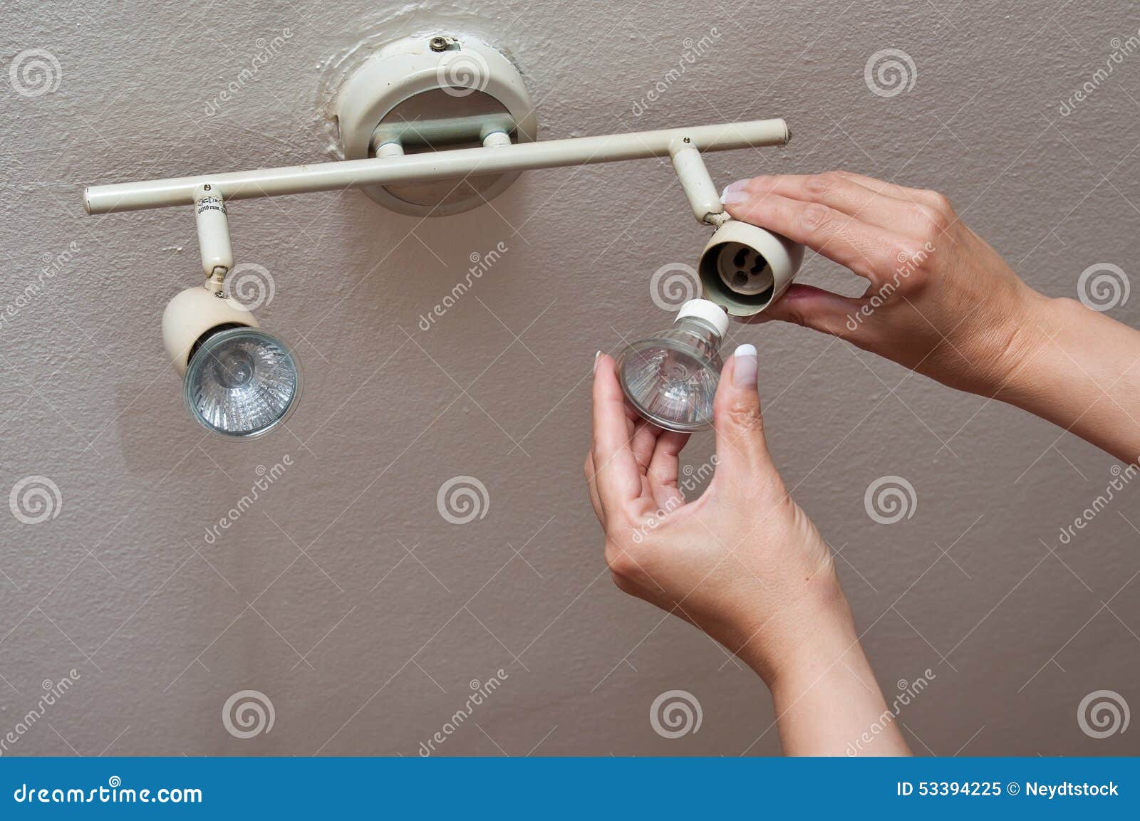 Woman Changing a Light Bulb Stock Image - Image of lights, bulb: 53394225