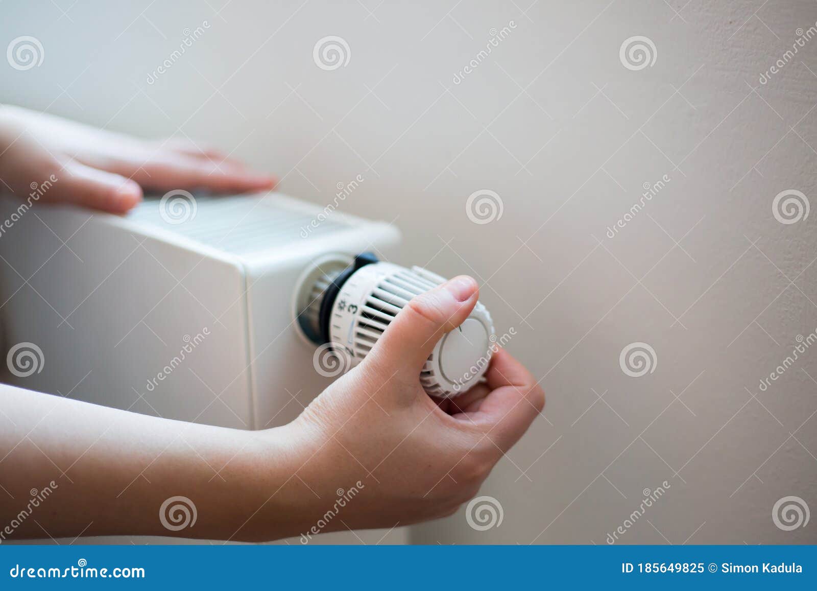 Woman Changing the Temperature on Radiator by Temperature Controller ...