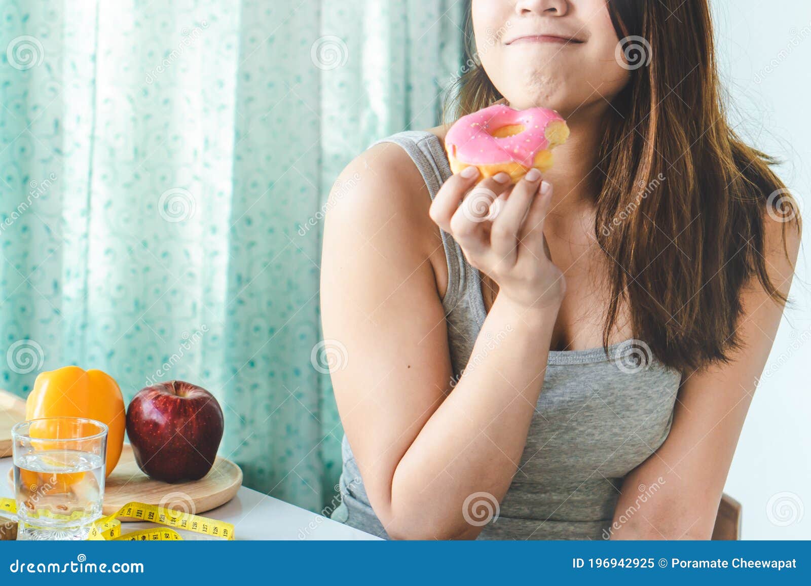 Woman Cheating during Diet and Eating Doughnut. Selective Focus on ...