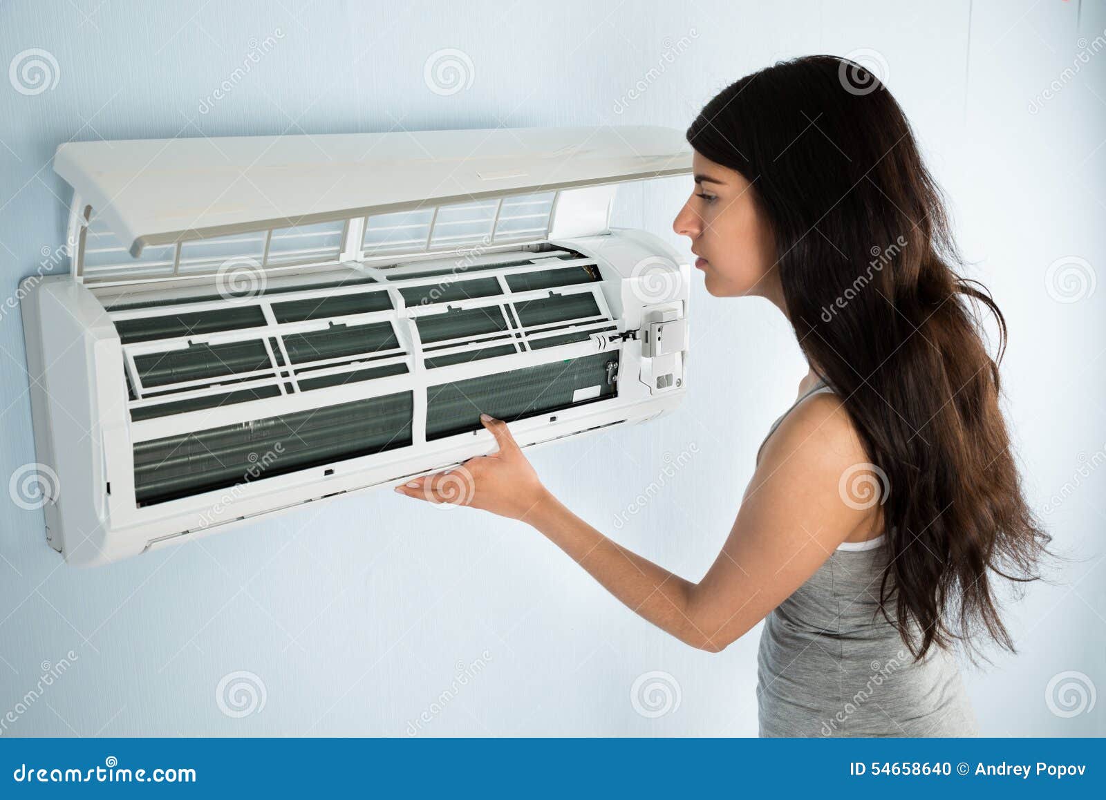 Woman Checking Air Conditioner Stock Photo - Image of electric ...