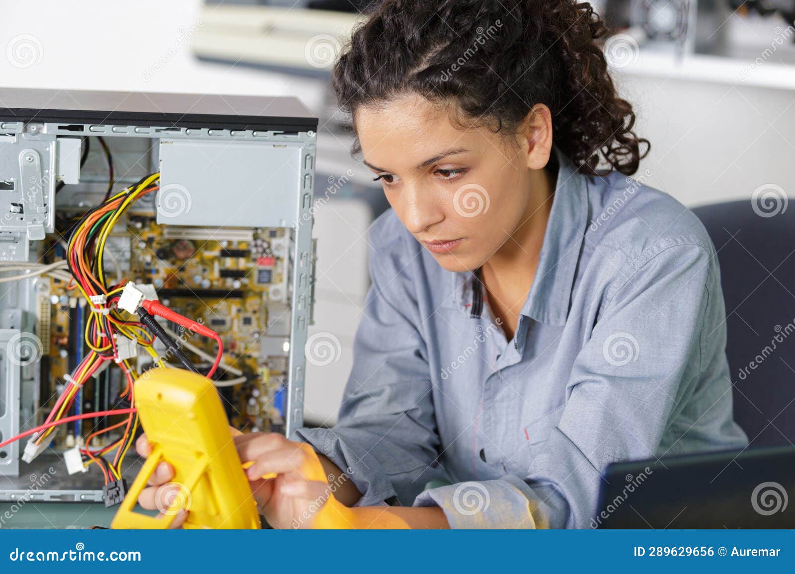 Woman Checking Computer with Multimeter Stock Photo - Image of modern ...