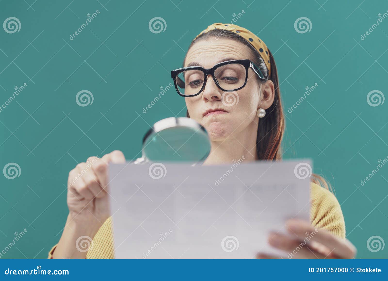 Woman Checking Carefully a Document Using a Magnifier Stock Photo ...