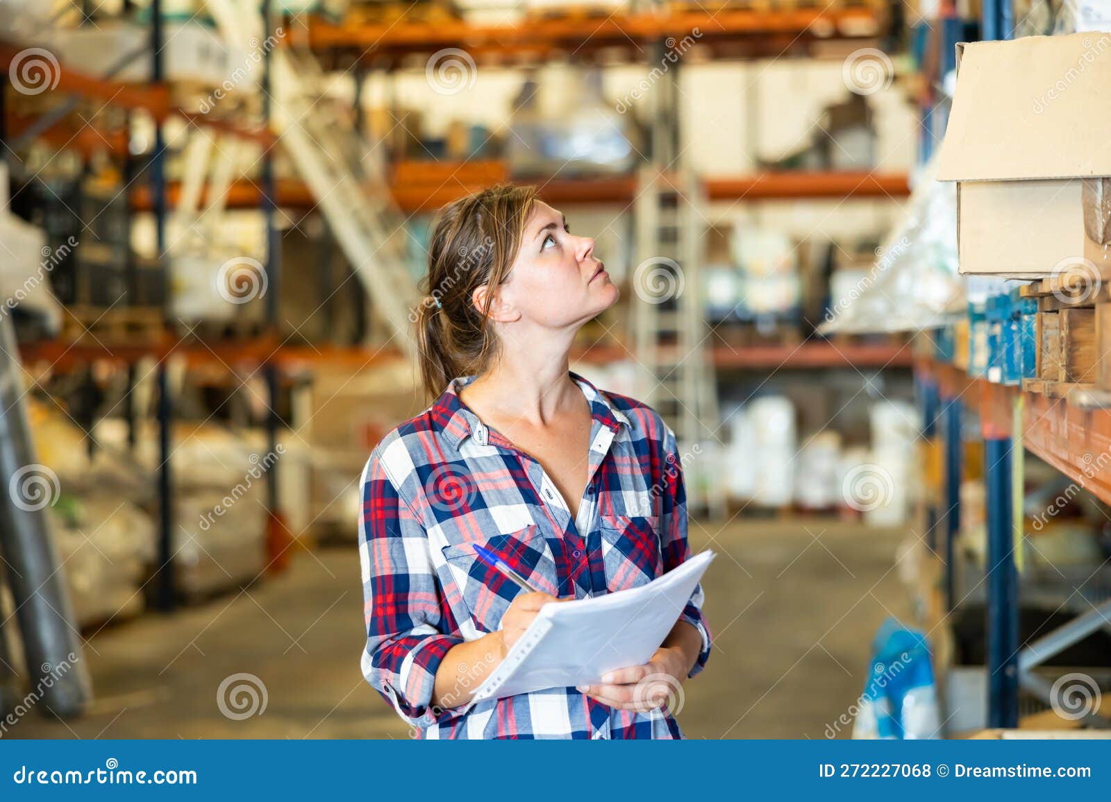 Woman Checking Documentation in Warehouse Stock Photo - Image of ...