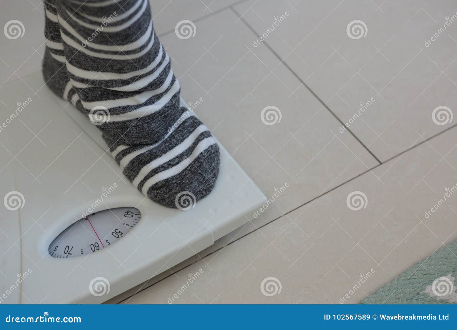Woman checking her weight stock image. Image of homey - 102567589