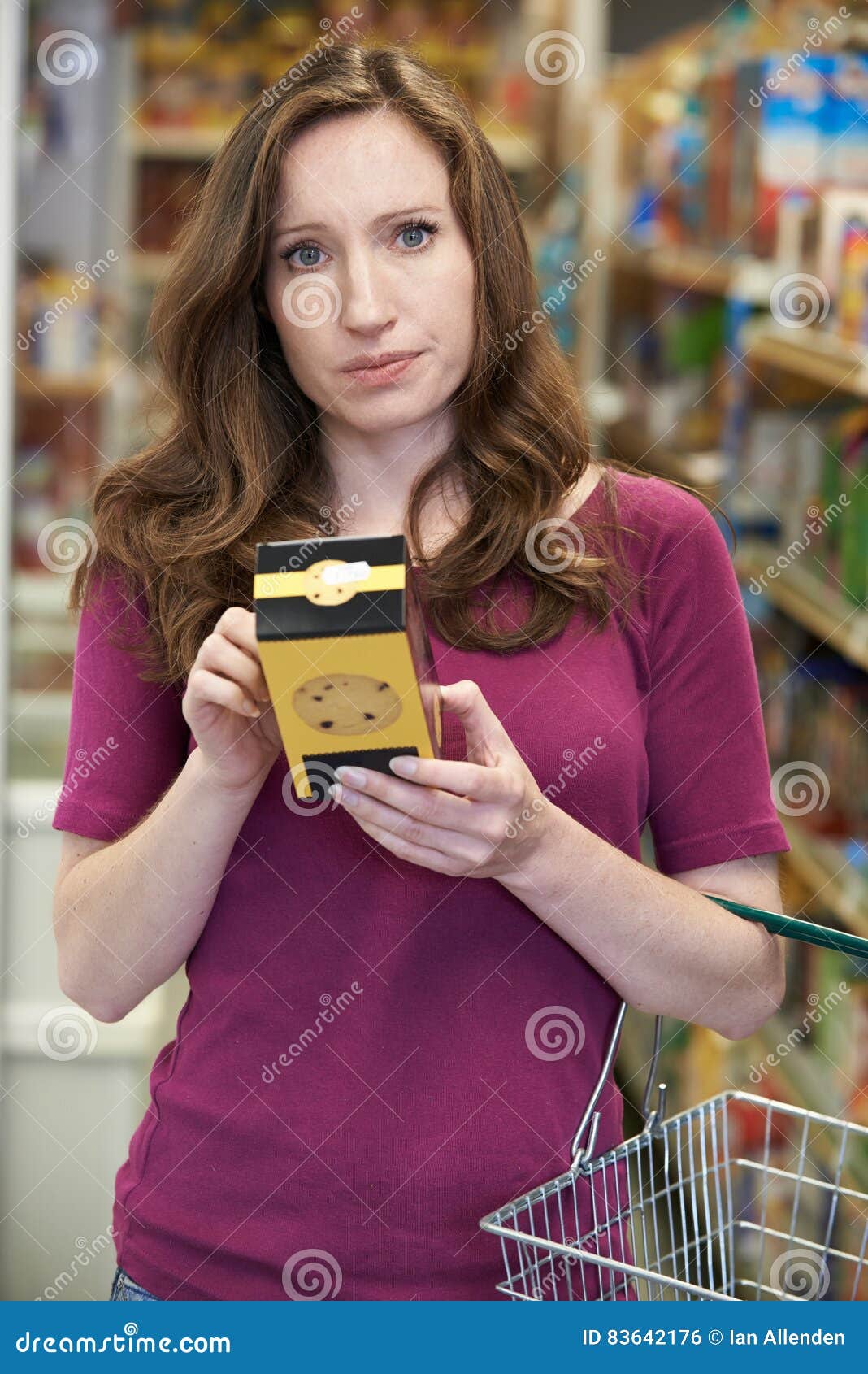 Woman Checking Labelling on Box in Supermarket Stock Photo - Image of ...