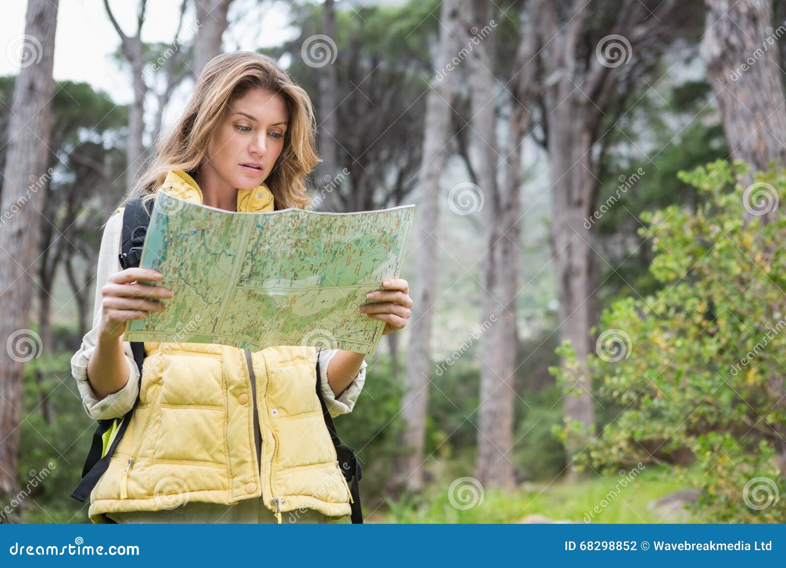 Woman checking the map stock photo. Image of activity - 68298852
