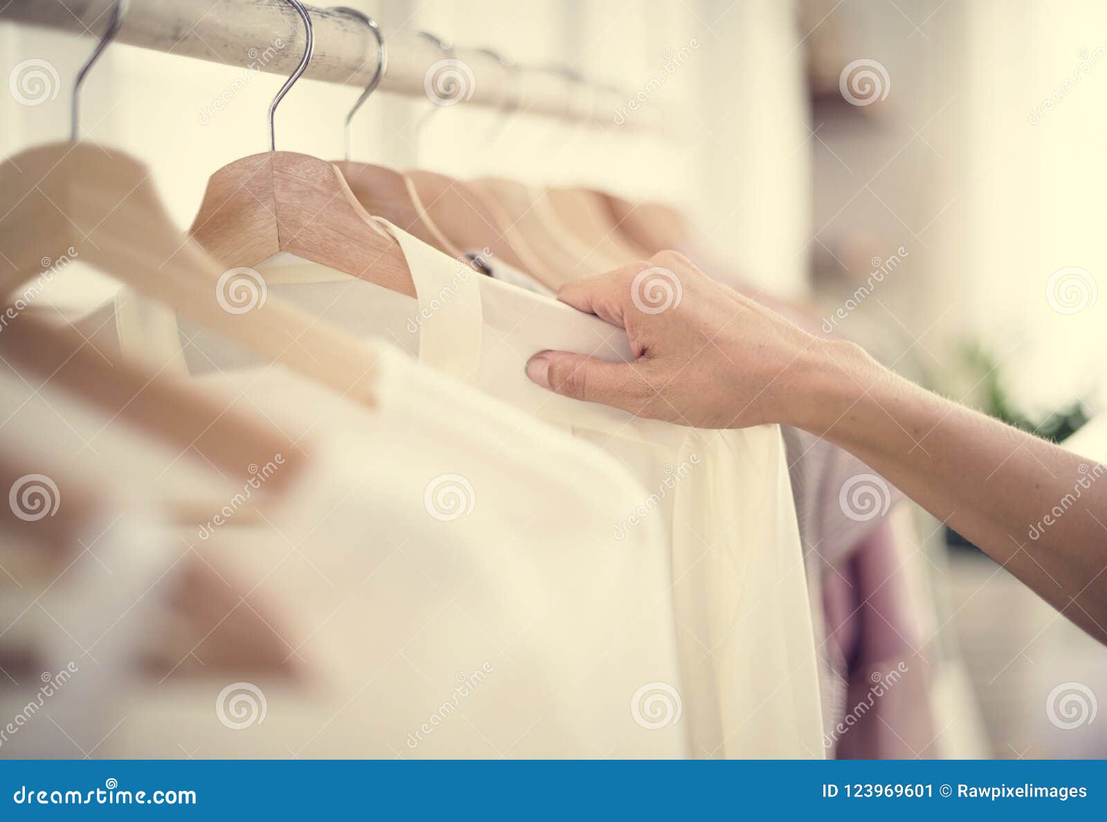 Woman checking out clothes stock image. Image of clothing - 123969601
