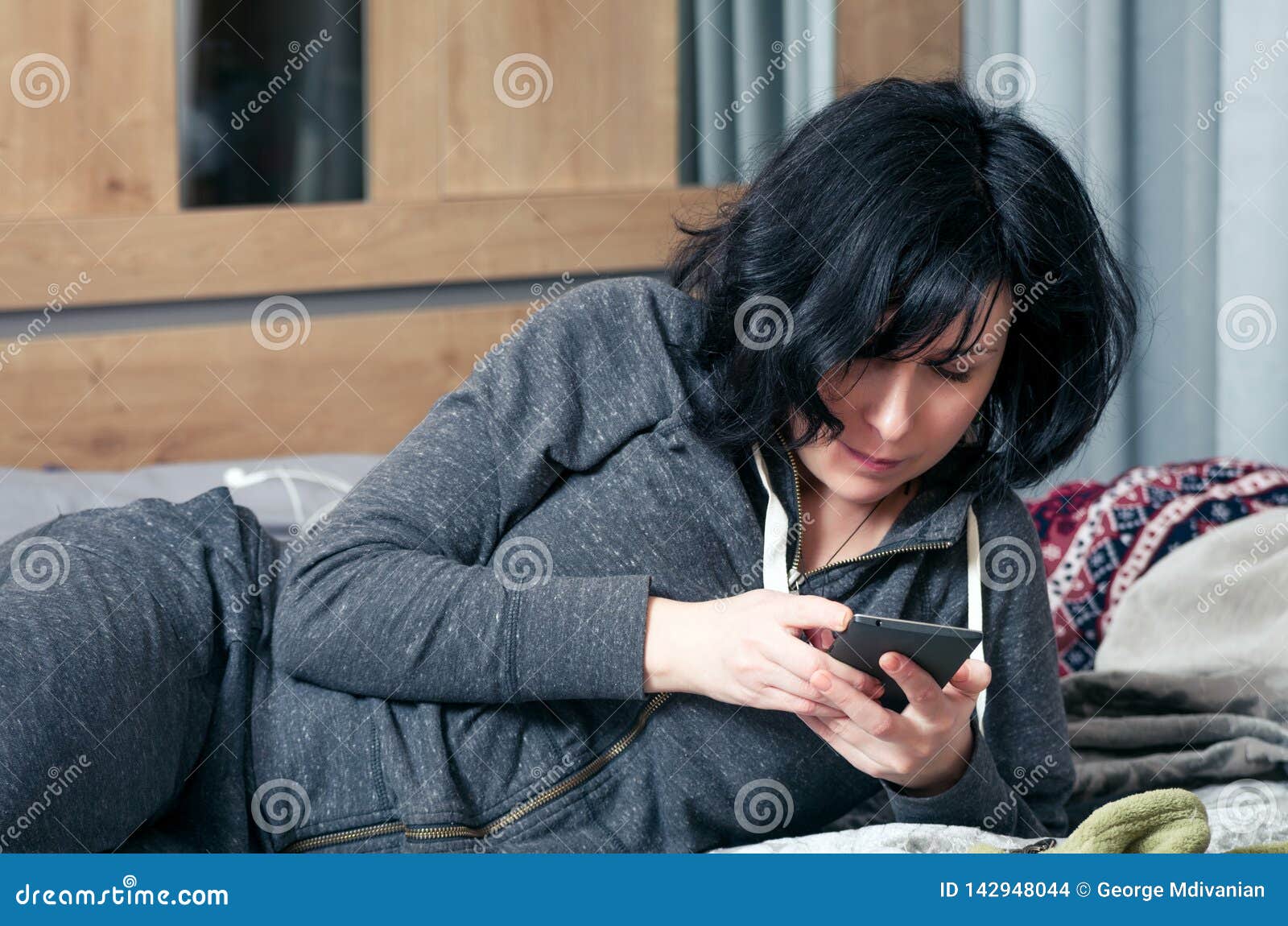 Woman checking the phone stock photo. Image of caucasian - 142948044