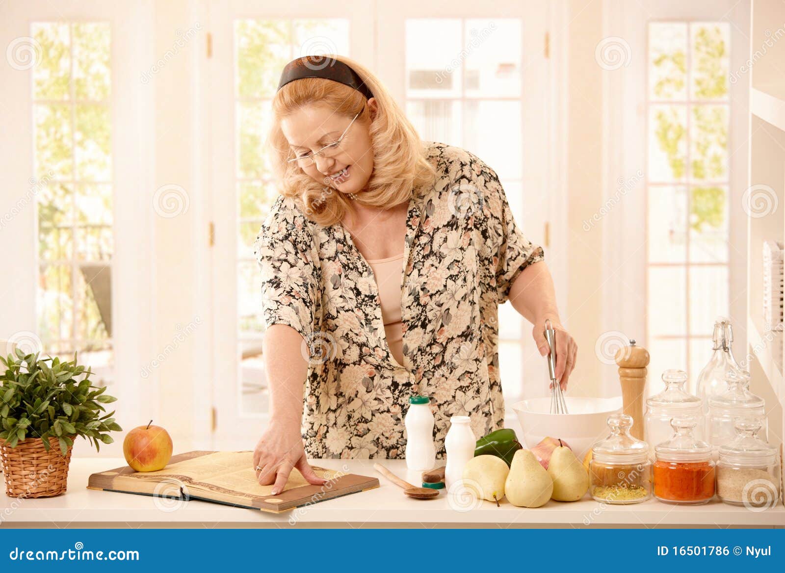 Woman Checking Recipe in Kitchen Stock Photo - Image of aged, alone ...