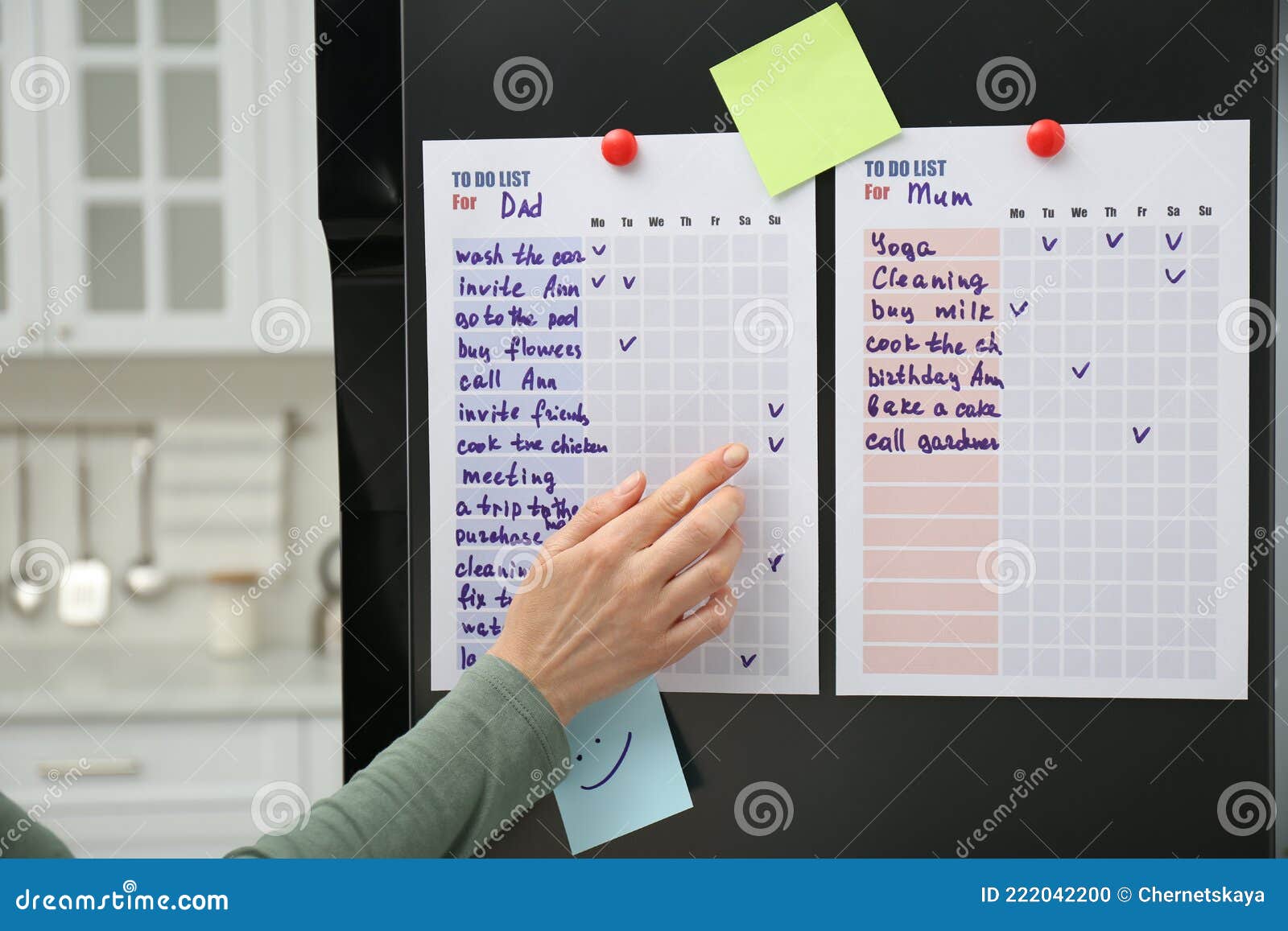 Woman Checking To Do List on Fridge in Kitchen Stock Photo - Image of ...