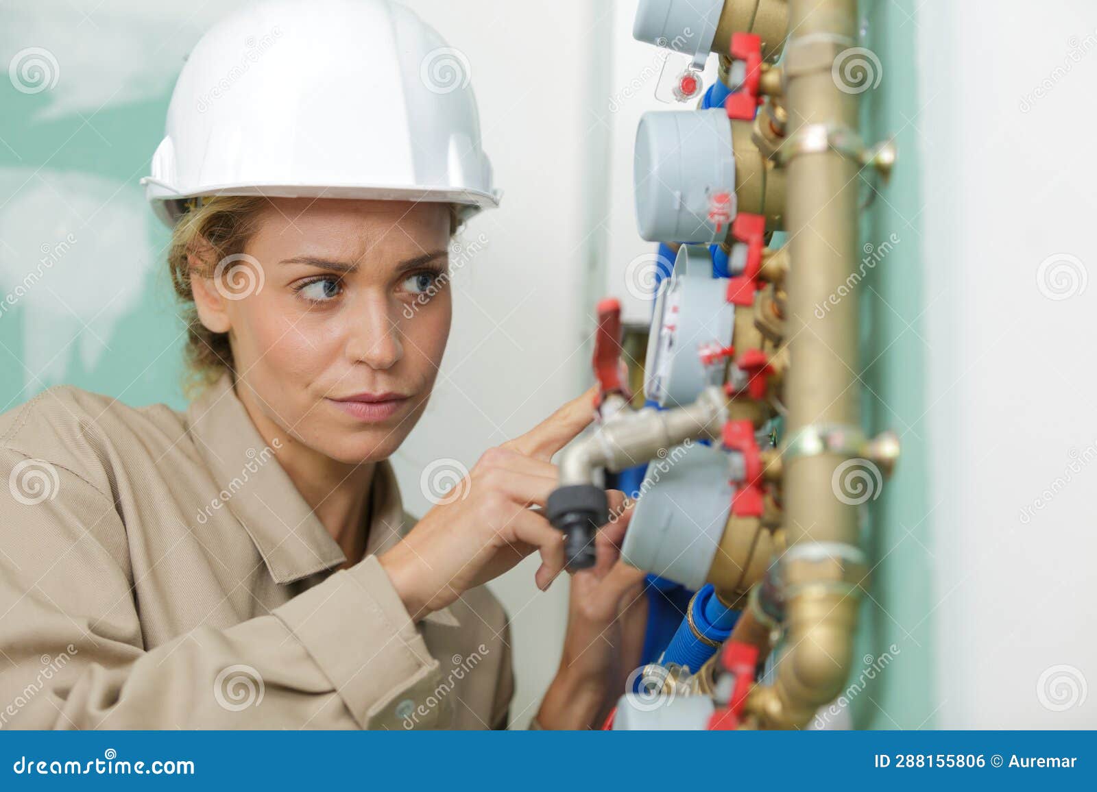 Woman checking water meter stock photo. Image of stain - 288155806