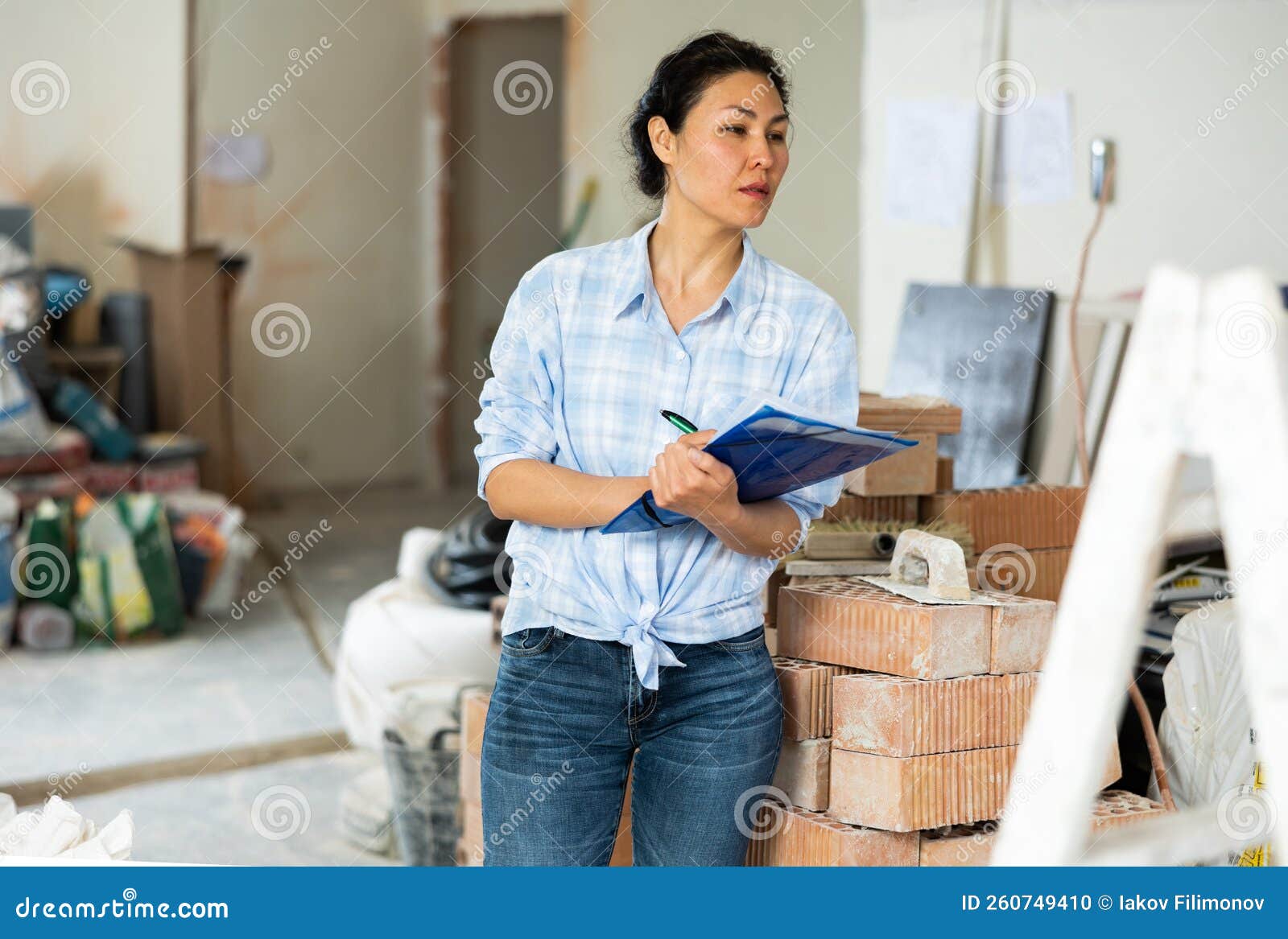 Woman Checks the Completed Construction Work on Drawing Stock Photo ...