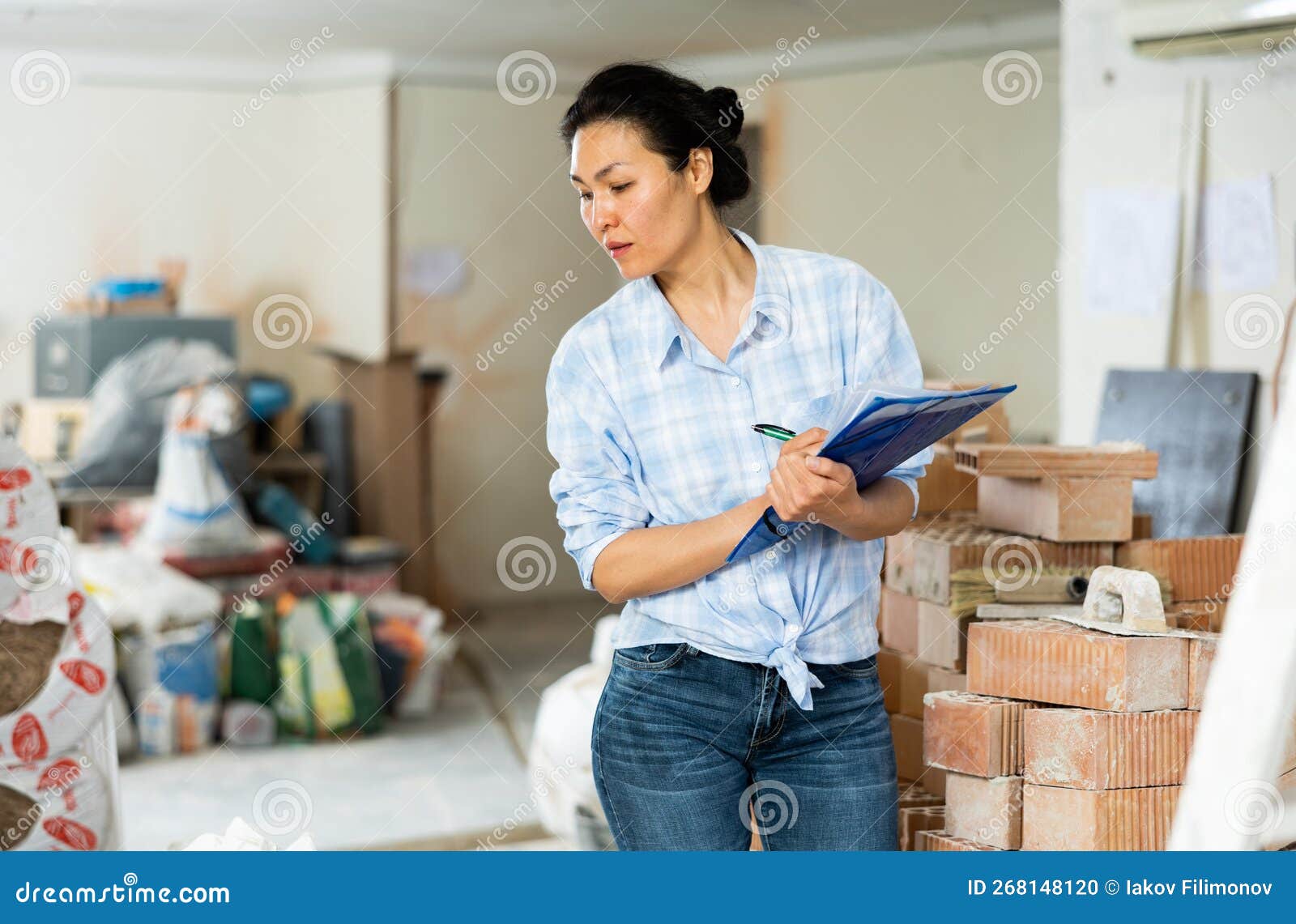 Woman Checks the Completed Construction Work on Drawing Stock Photo ...