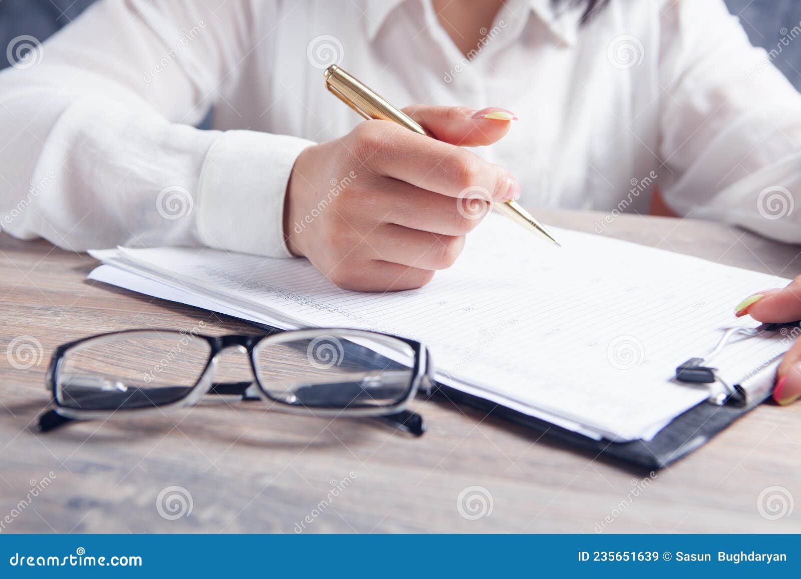 Woman Checks Papers in Front of the Table. Optical Glasses Stock Image ...