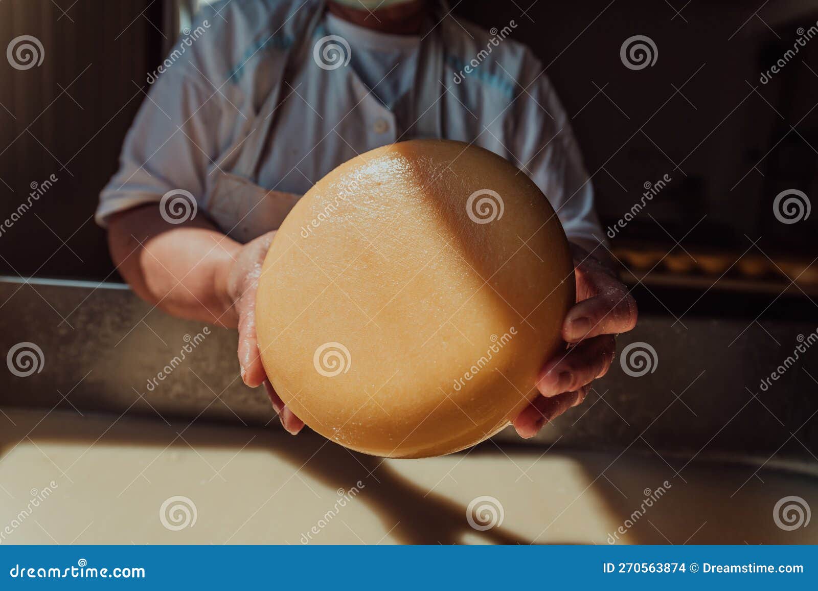 A Woman in the Cheese Industry. Woman Preparing Cheese for Further ...