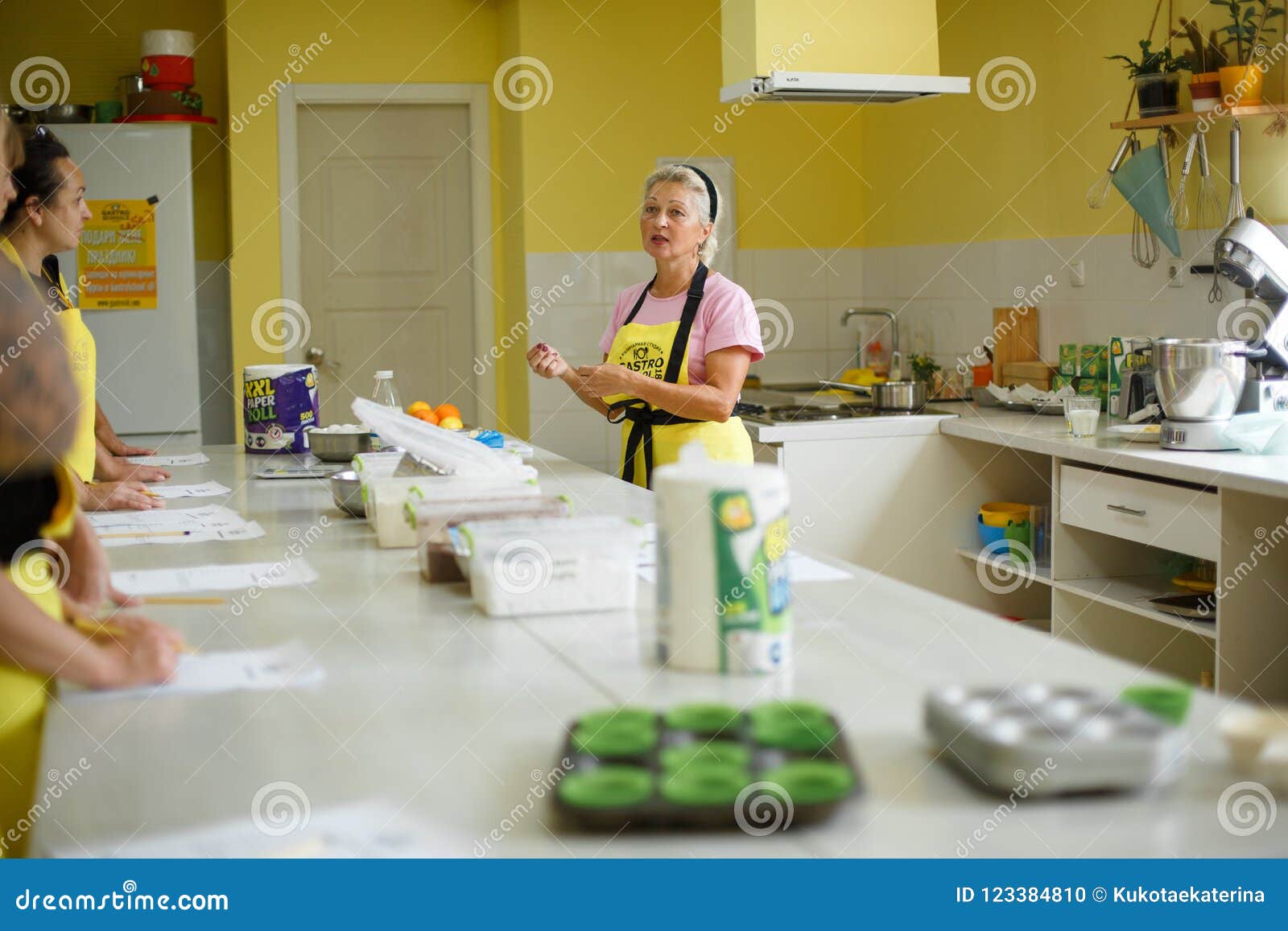 Woman Chef Cook Speak about Cooking in Kitchen of Cooking School ...
