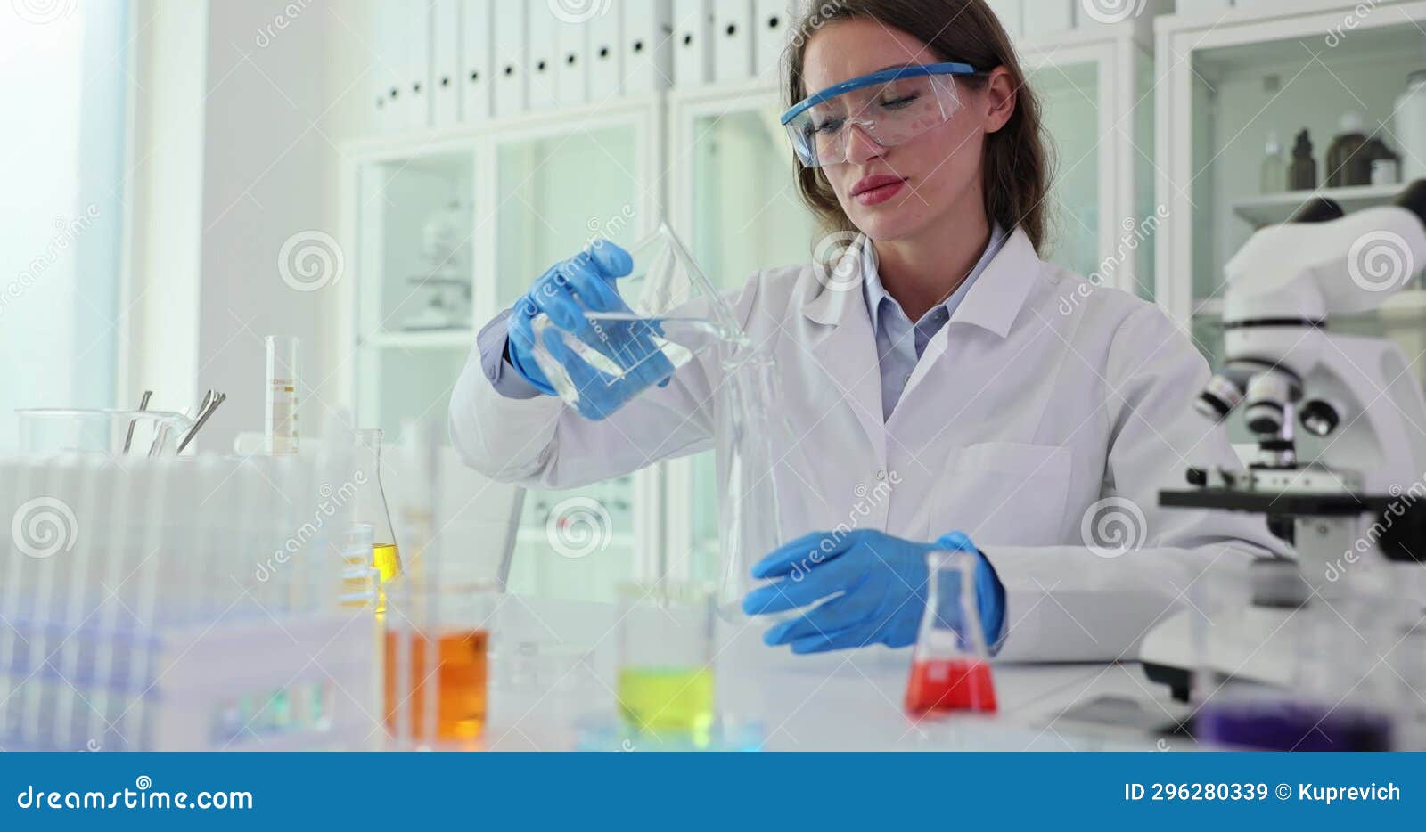 Woman Chemist Pours Sample into Glass Flask for Experiment Stock Video ...