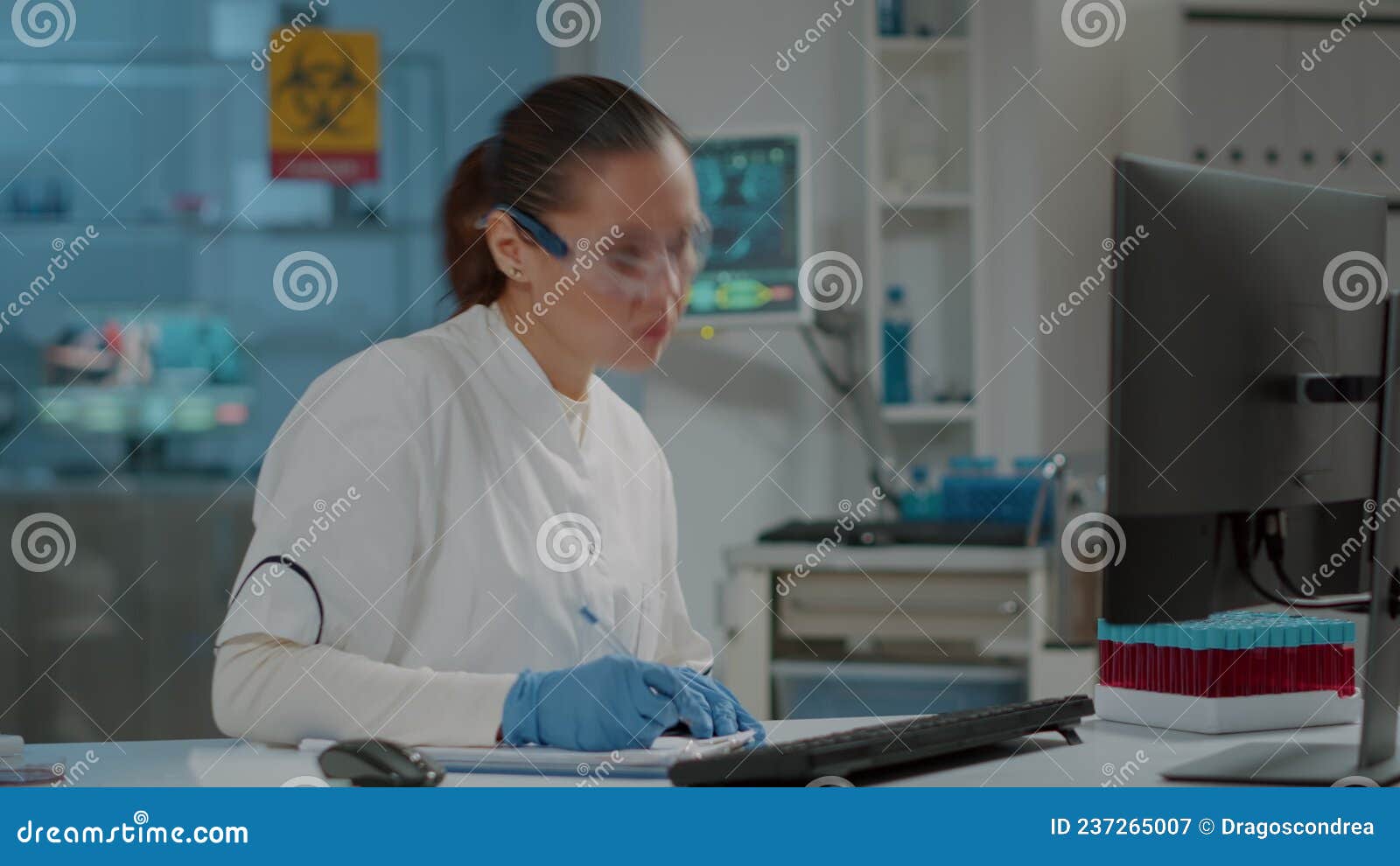 Woman Chemist Taking Notes for Science Research in Laboratory Stock ...