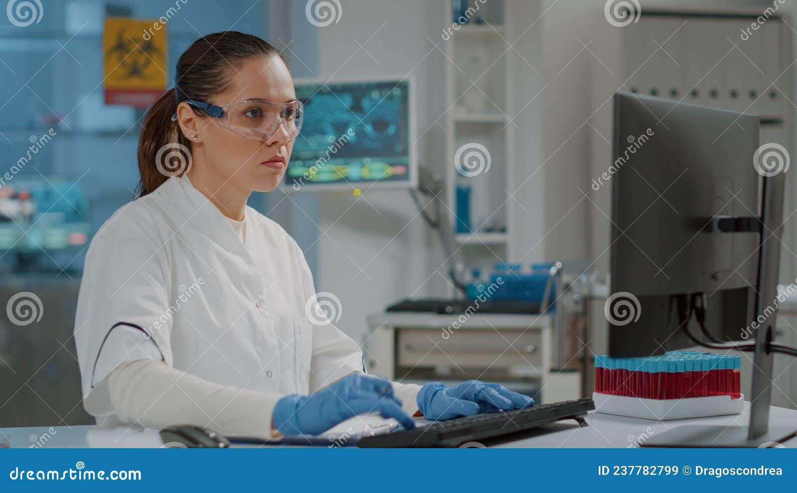 Woman Chemist Taking Notes for Science Research in Laboratory Stock ...