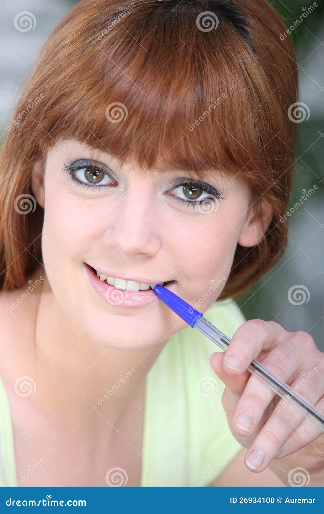 Woman chewing on a pen stock photo. Image of contact - 26934100