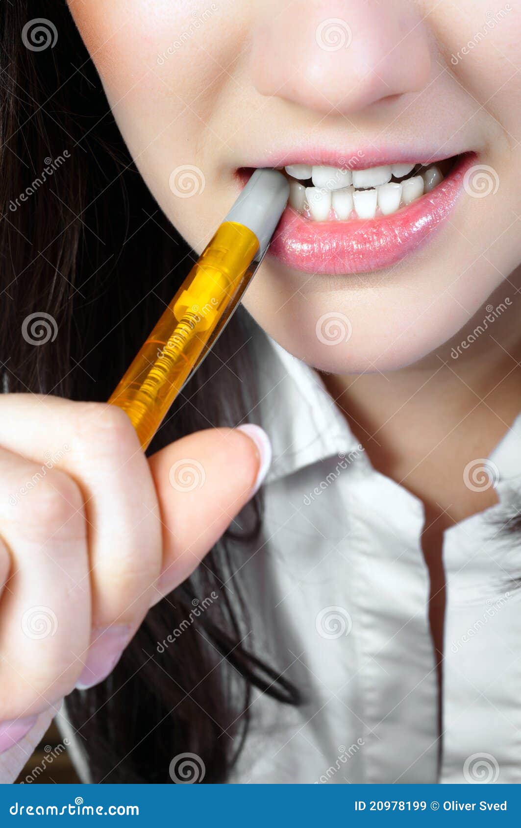 Woman Chewing on a Pencil stock image. Image of chew - 20978199