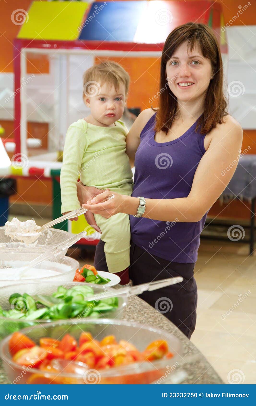 Woman with Chid Chooses Snack in Buffet Stock Photo - Image of ...