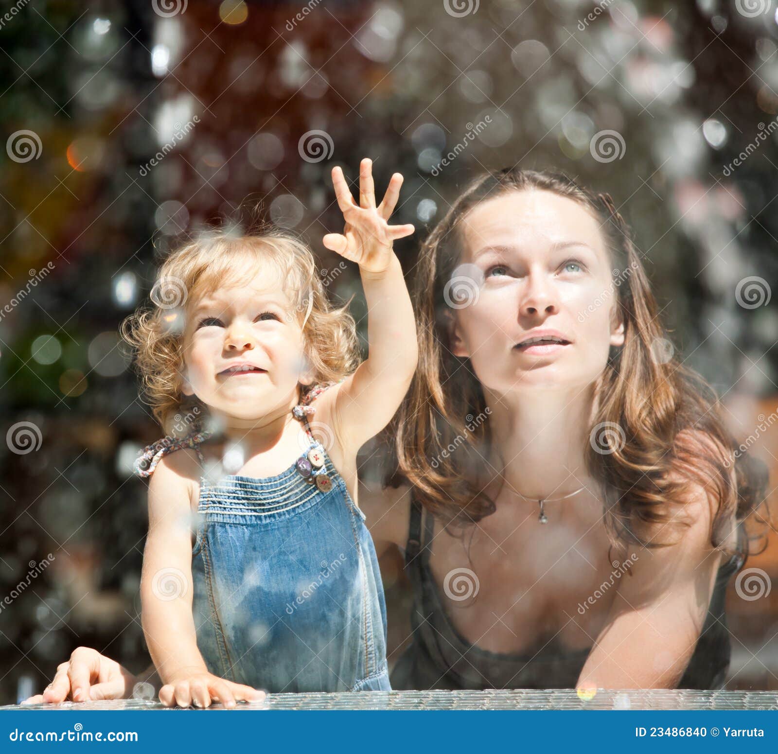 Woman with child playing stock photo. Image of family - 23486840