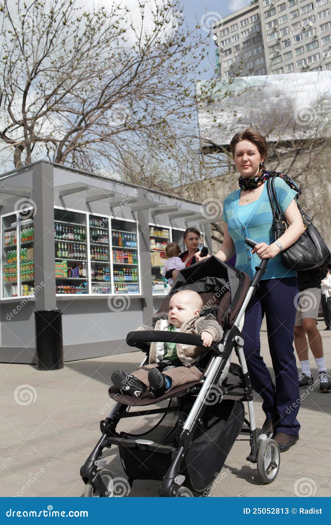 Woman with Child in Stroller Stock Image - Image of contemporary ...