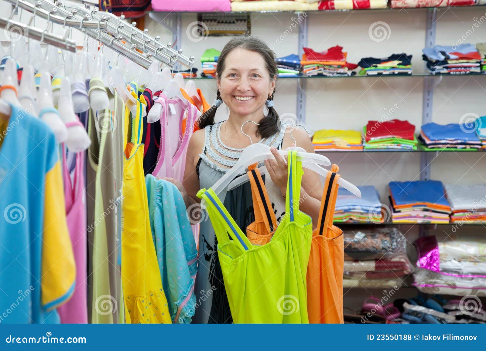 Woman Chooses Clothes at Shop Stock Photo - Image of luxury, adult ...