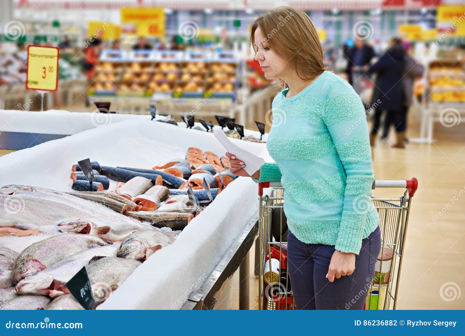Woman Chooses Fresh Fish in Supermarket Stock Photo - Image of green ...