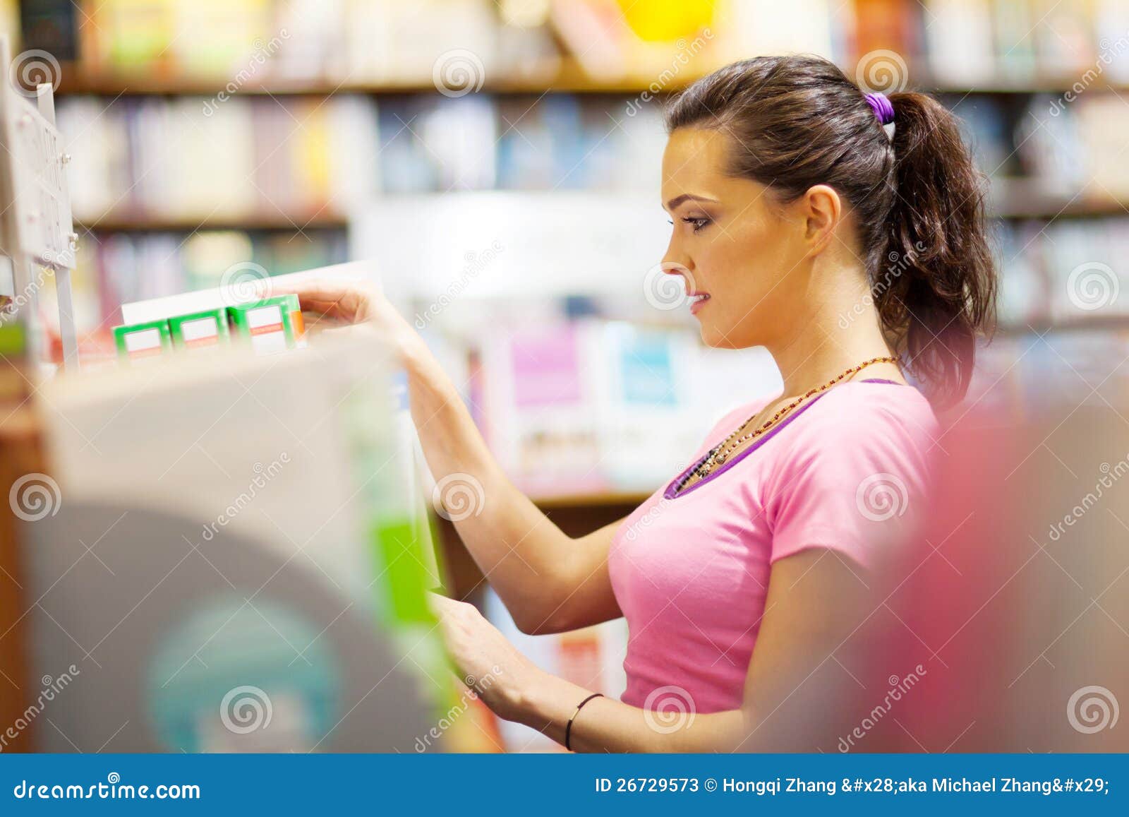 Woman choosing book stock image. Image of book, reading - 26729573