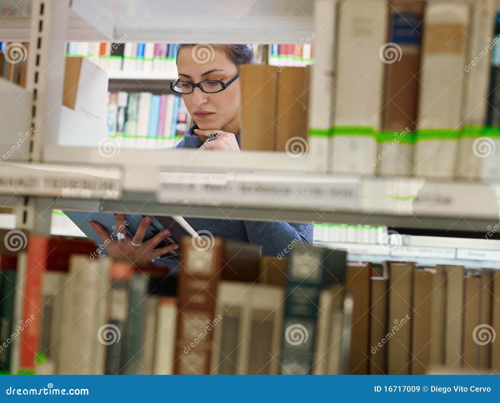 Woman Choosing Book in Library Stock Image - Image of away, order: 16717009