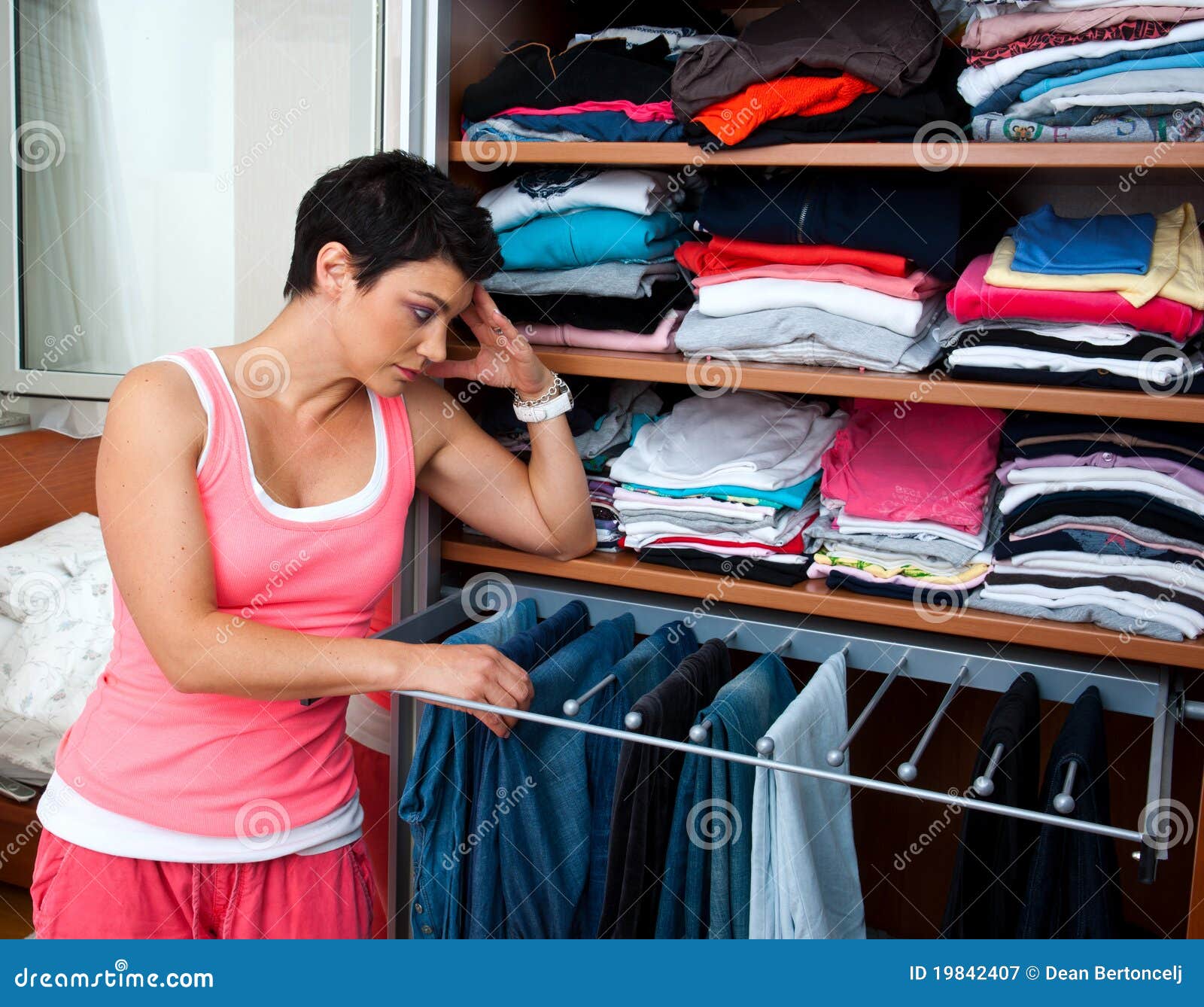 Woman choosing clothes stock image. Image of choosing - 19842407