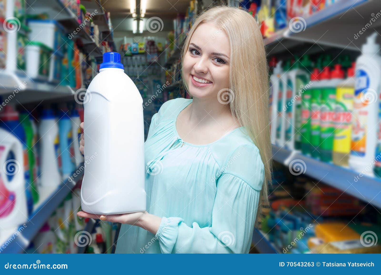 Woman choosing detergent stock image. Image of choosing - 70543263