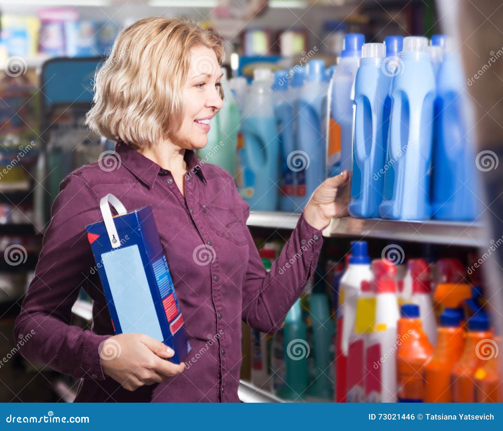 Woman choosing detergent stock photo. Image of alone - 73021446