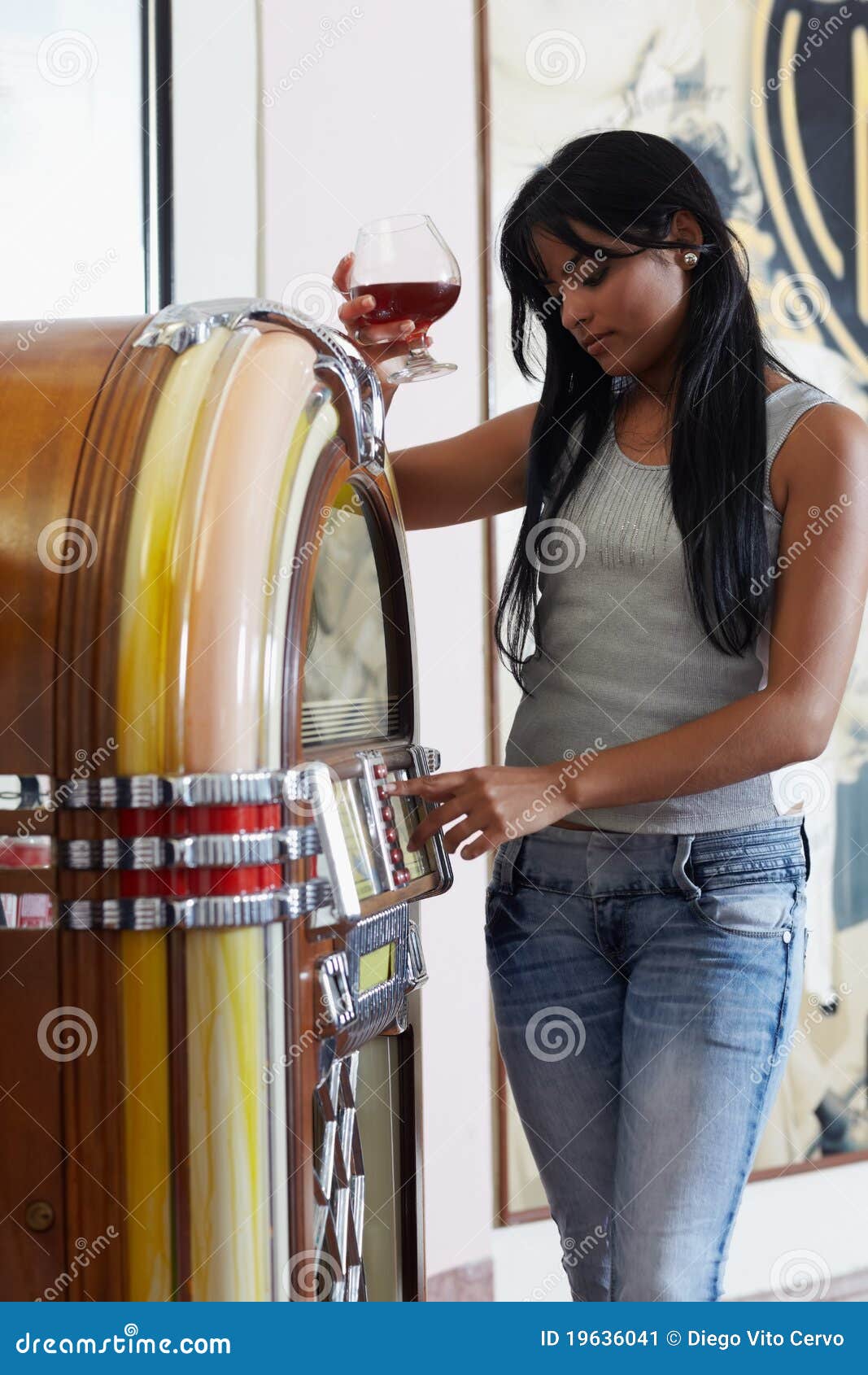 Woman Choosing Song On Juke Box Stock Image - Image: 19636041 Woman Choosing Song On Juke Box Stock Image - Image: 19636041