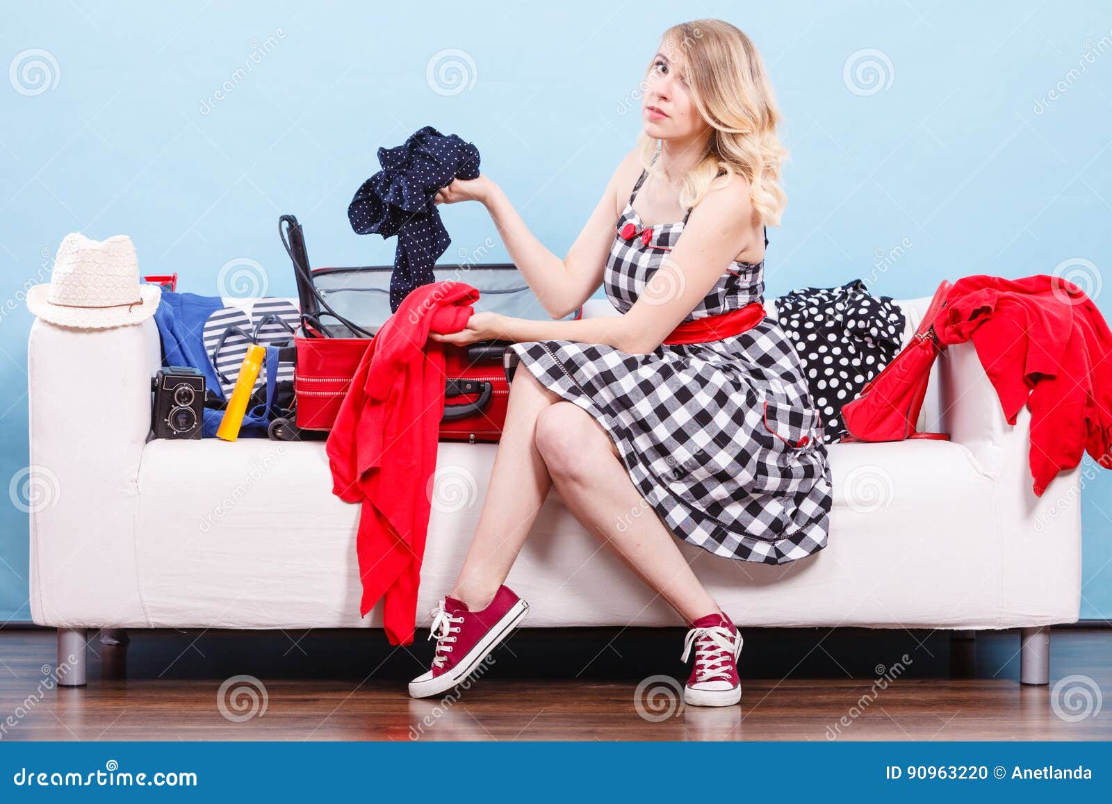 Woman Choosing Things To Pack into Suitcase Stock Photo - Image of ...