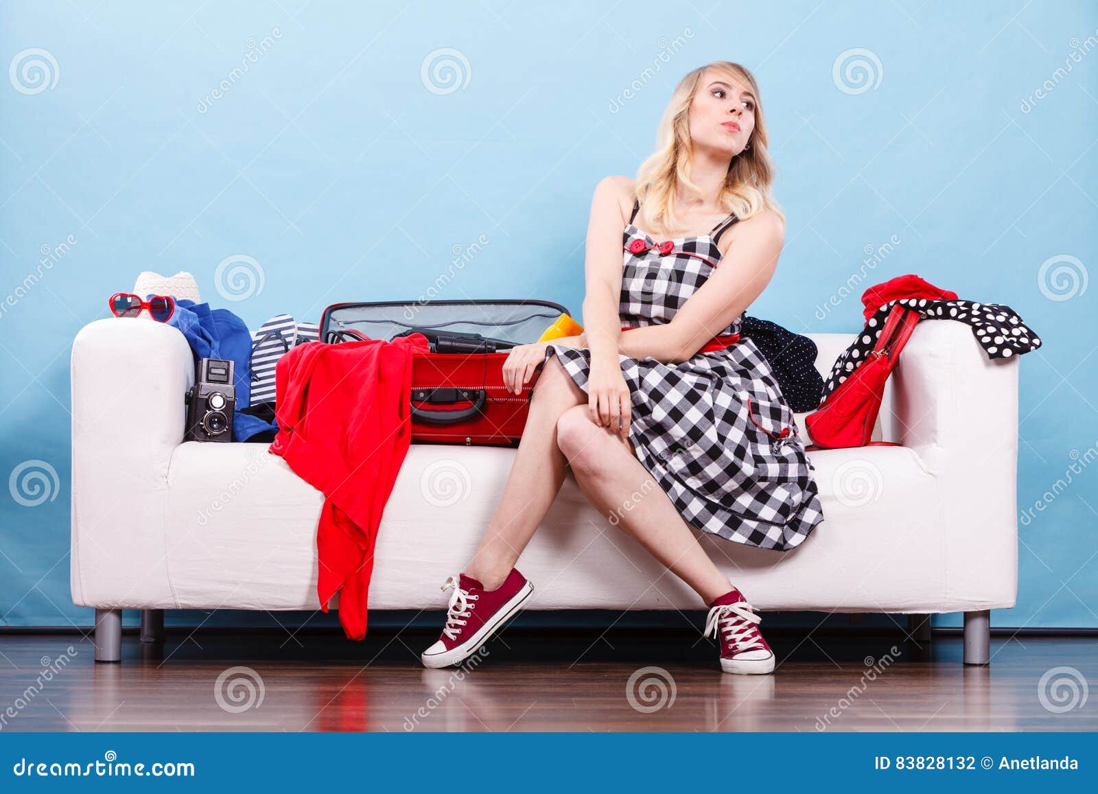 Woman Choosing Things To Pack into Suitcase Stock Photo - Image of ...