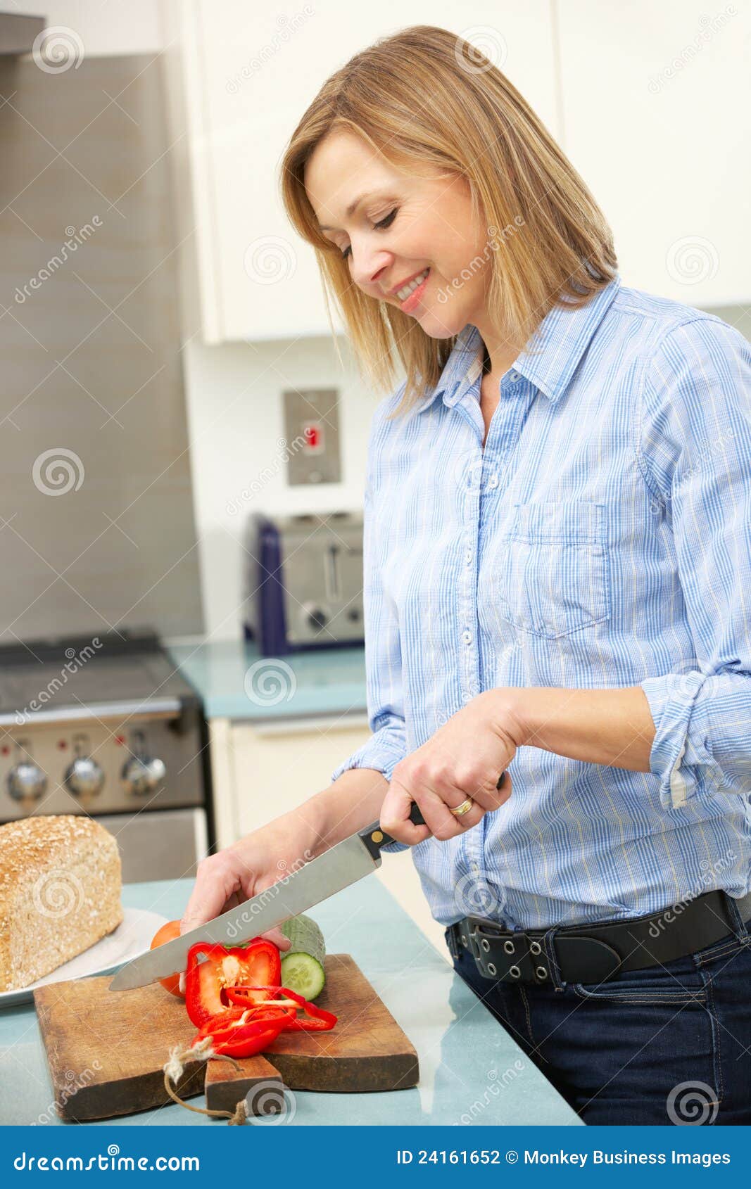 Woman Chopping Vegetables in Domestic Kitchen Stock Photo - Image of ...