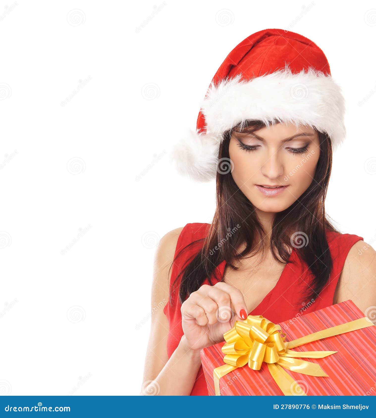 A Woman in a Christmas Hat Opening a Present Stock Photo - Image of ...
