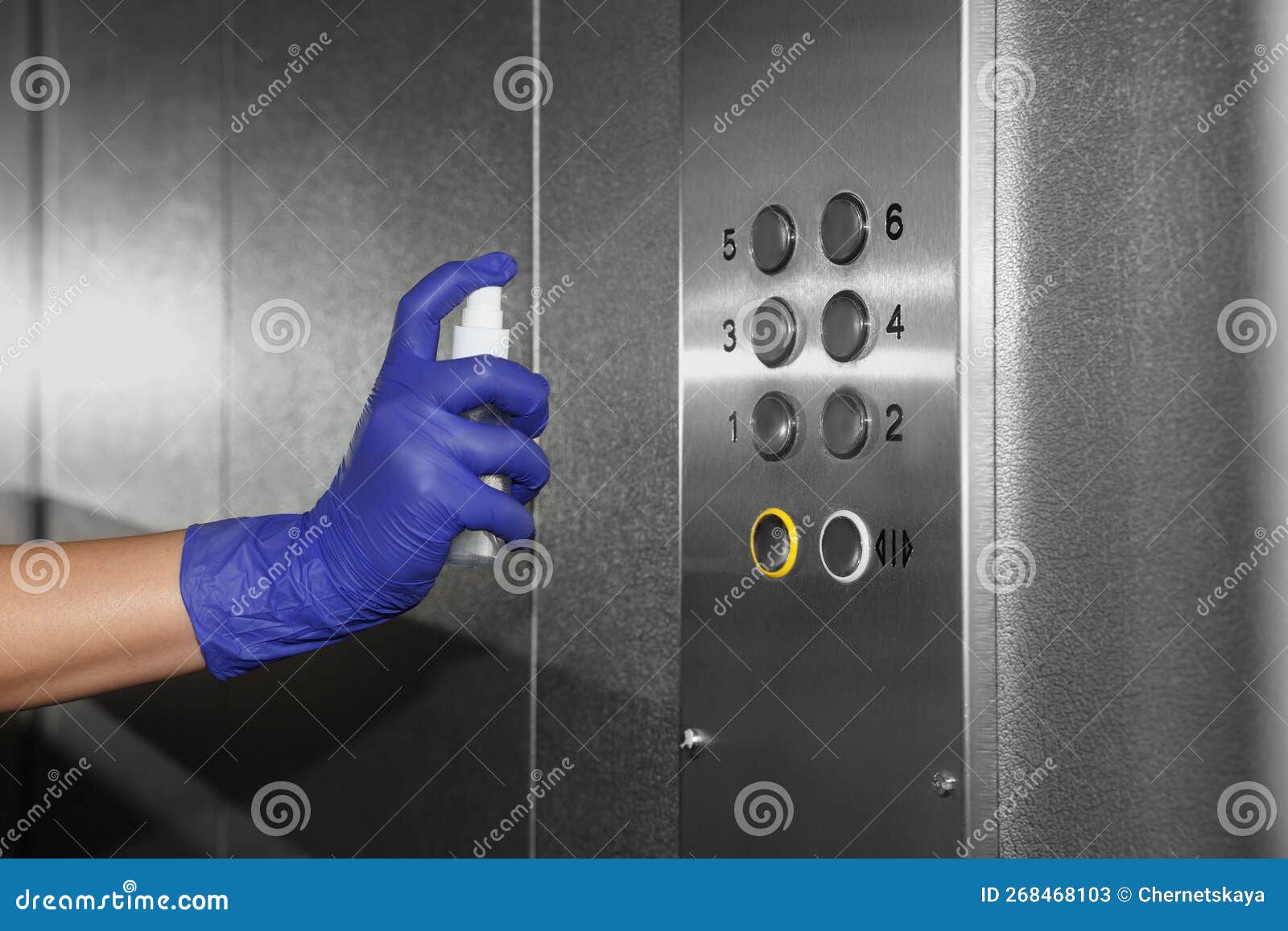 Woman Cleaning Buttons Panel in Elevator with Detergent Spray, Closeup Stock Image - Image of ...
