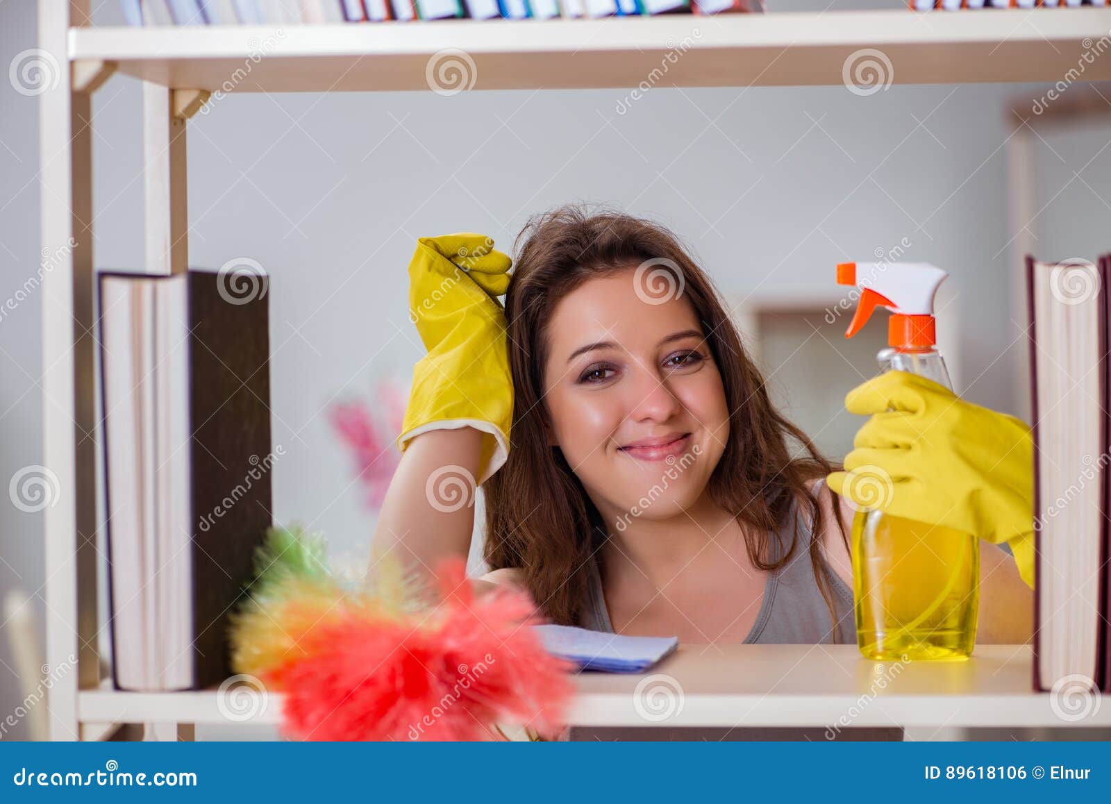The Woman Cleaning Dust from Bookshelf Stock Photo - Image of fluffy ...